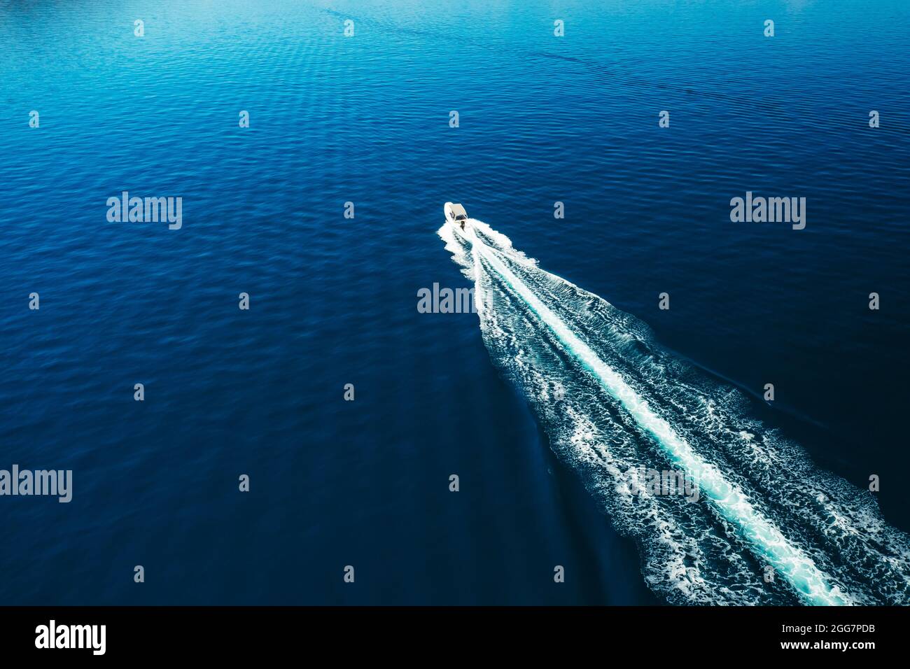 Aerial view of motor boat sailing in the sea. Amazing seascape with the ...