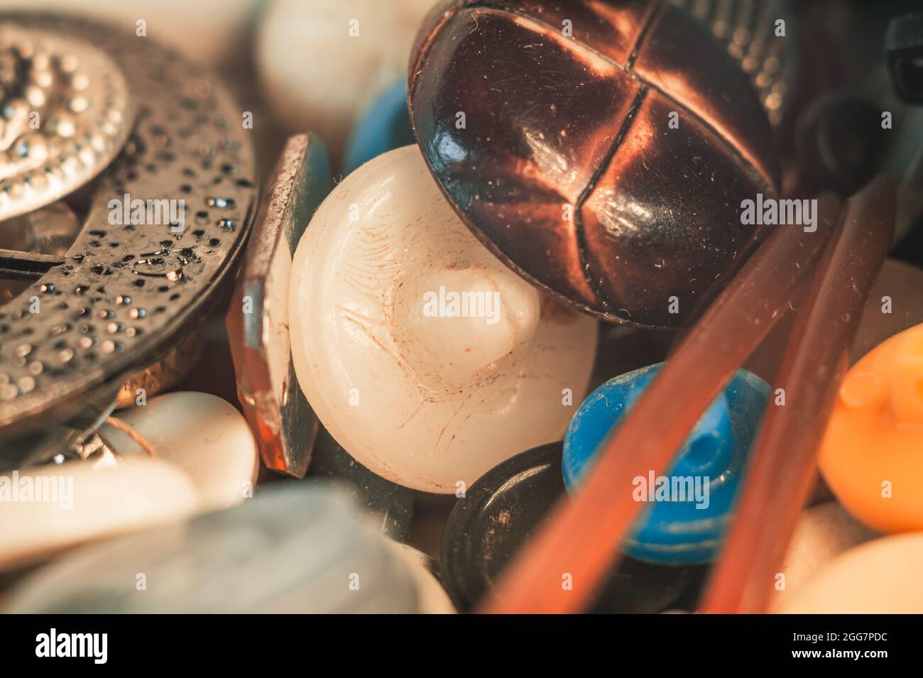 A selective shot of mix of cloth buttons of different color and size ...