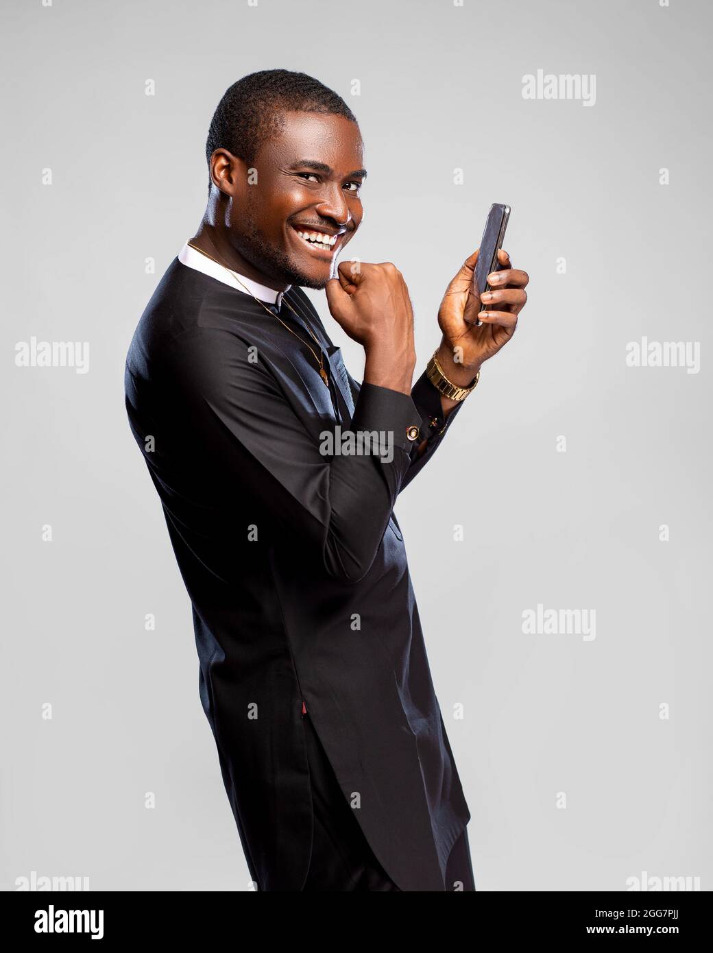 Portrait african man celebrating using hi-res stock photography and ...