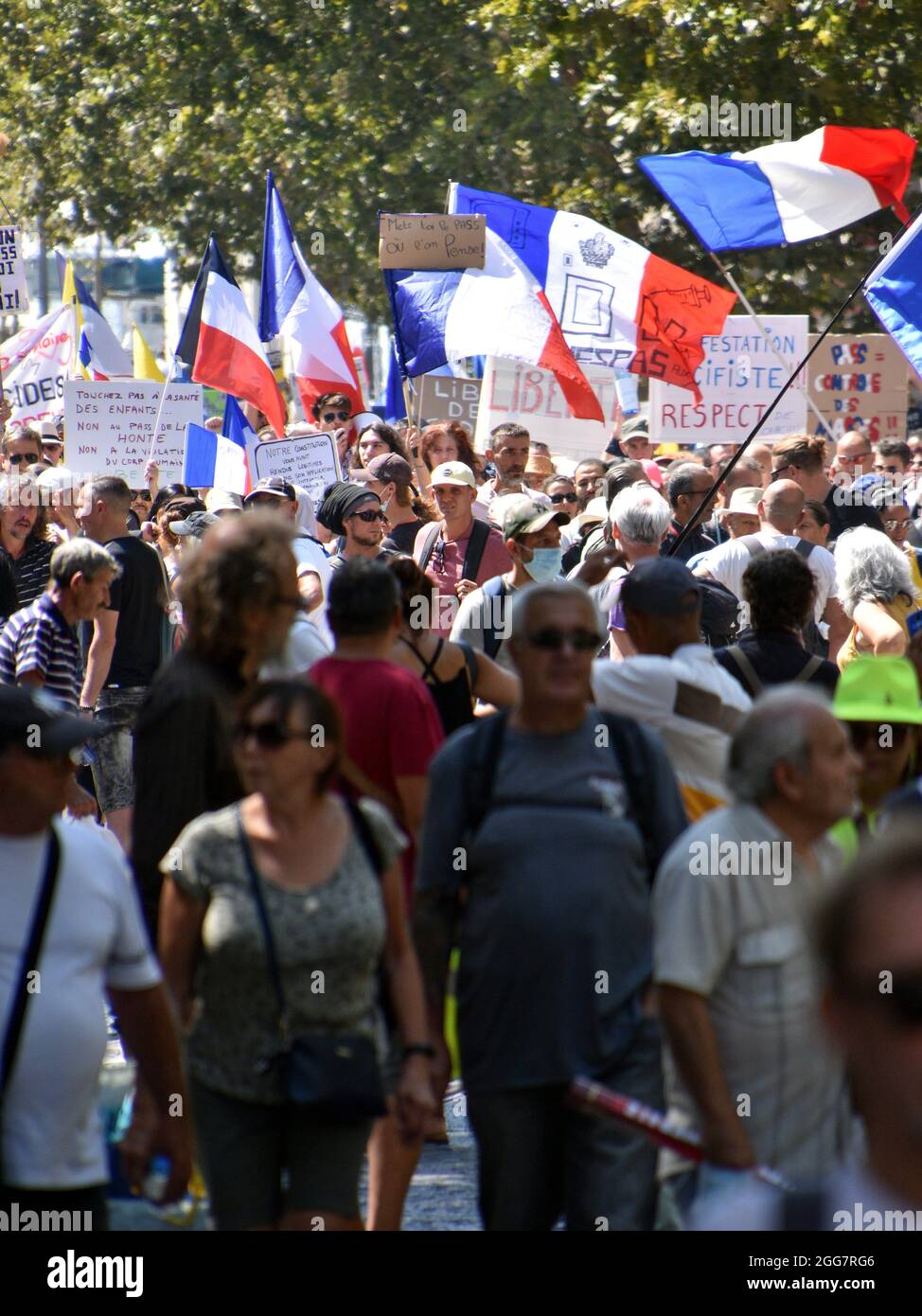 Protesters march through the Streets while holding flags during the ...