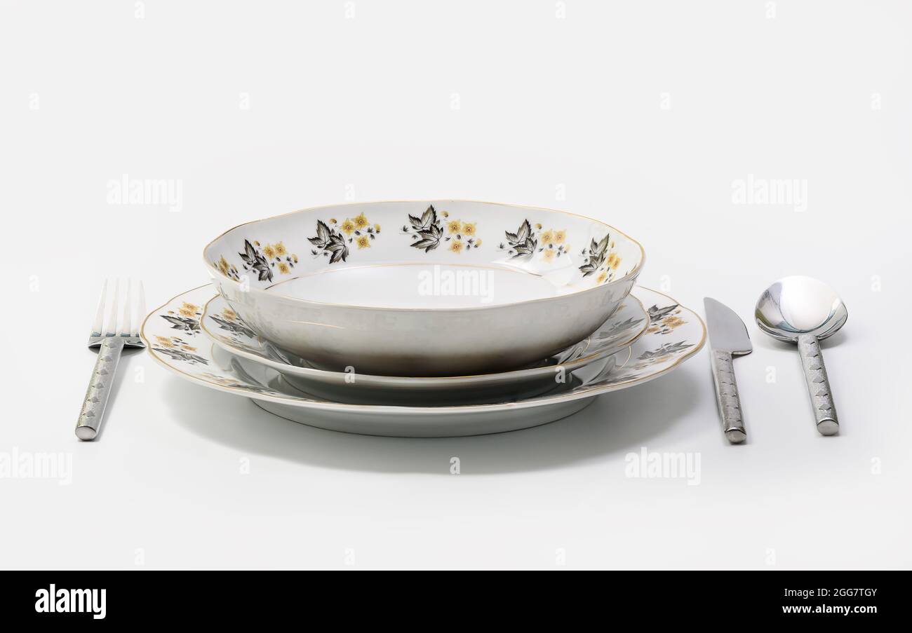 Luxury Vintage Porcelain tableware - Set of Plates with Utensils on ...