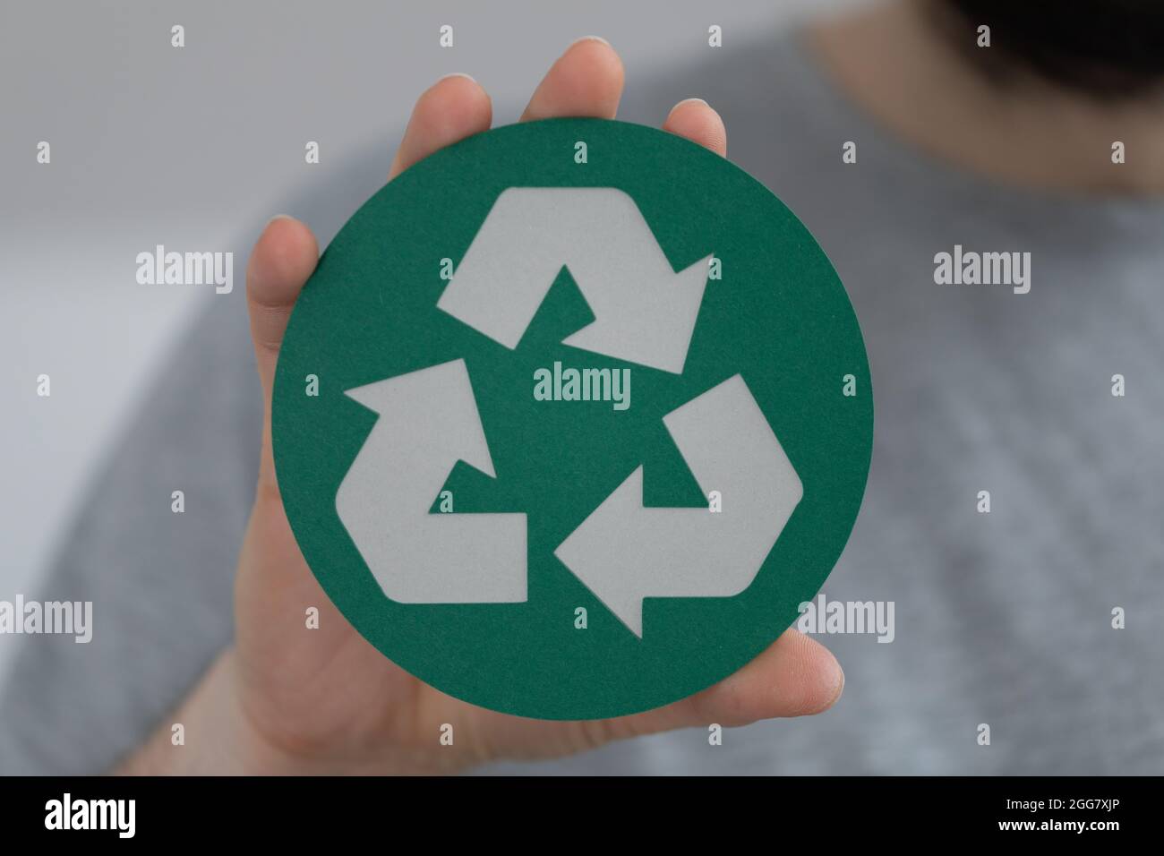 A green recycling sign on a person's hand - ecology concept Stock Photo ...