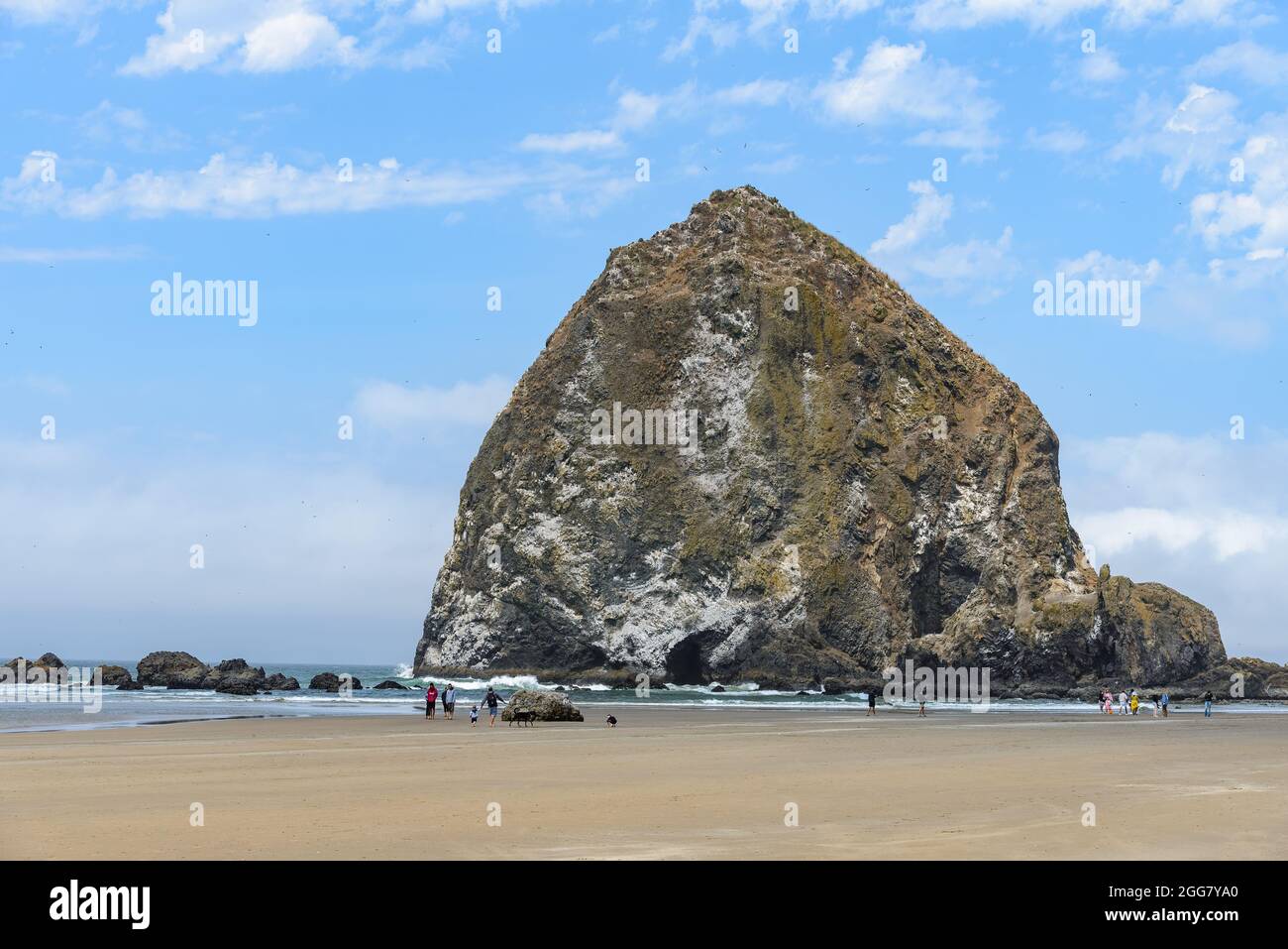 Haystack Rock is a big tourist attraction at the Cannon Beach, Oregon ...