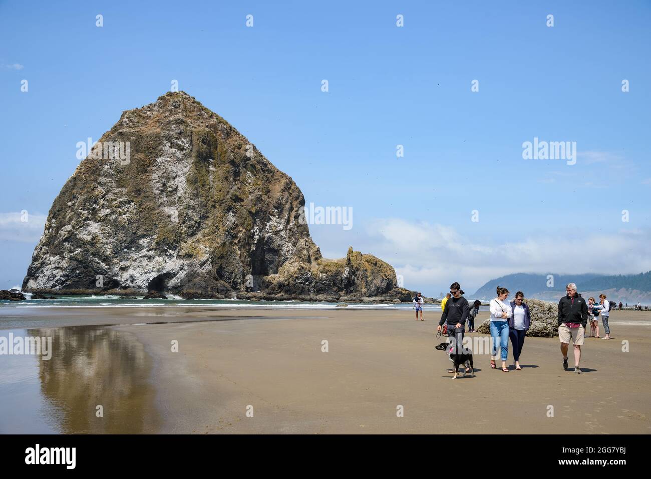 Haystack Rock is a big tourist attraction at the Cannon Beach, Oregon ...