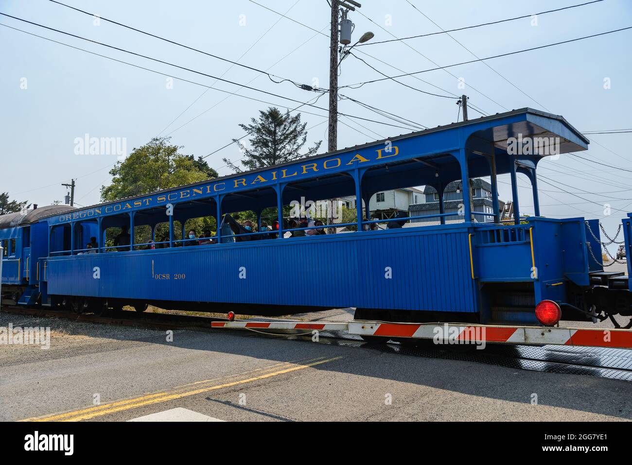 Tourists ride blue train from Oregon Coast Scenic Railroad. Tallimook ...