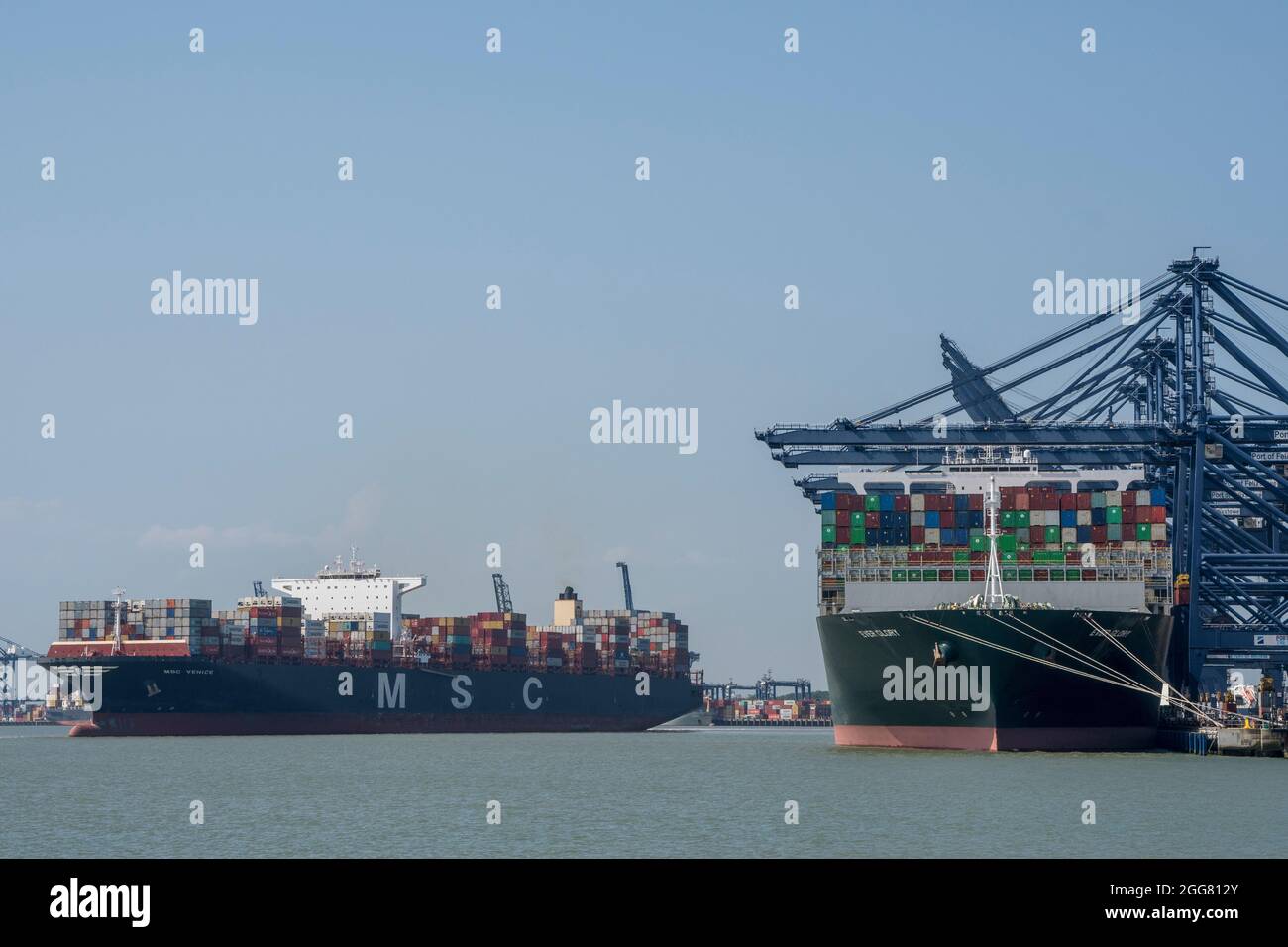 MSC Venice being pulled out of Felixstowe Docks by tugboats Stock Photo ...