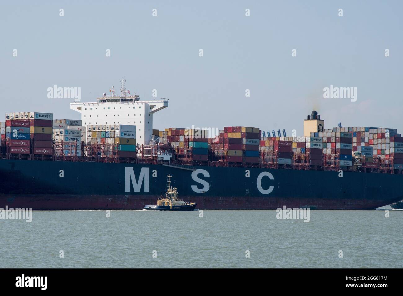 MSC Venice being pulled out of Felixstowe Docks by tugboats Stock Photo ...