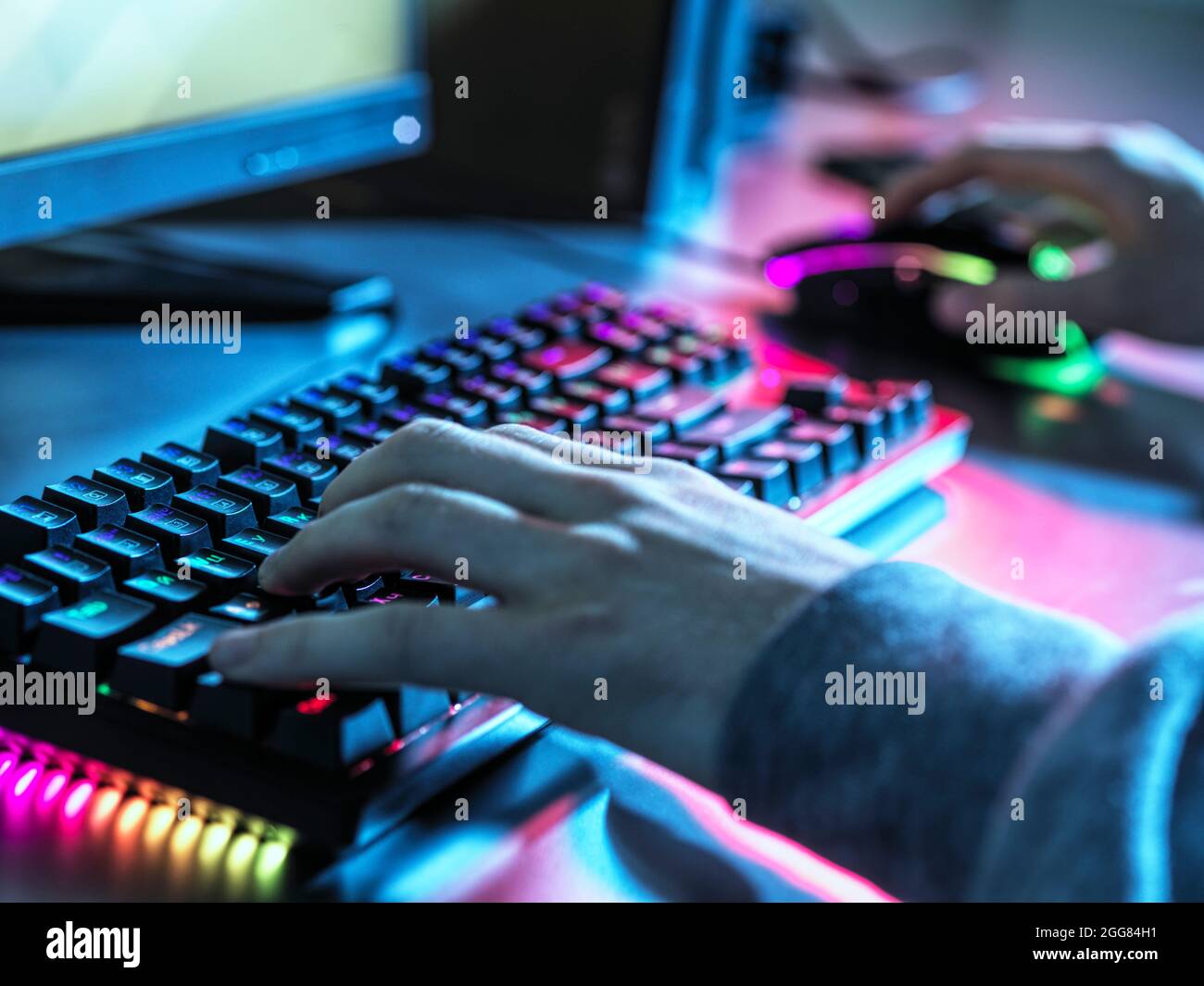 Teenage boy using keyboard and mouse Stock Photo - Alamy