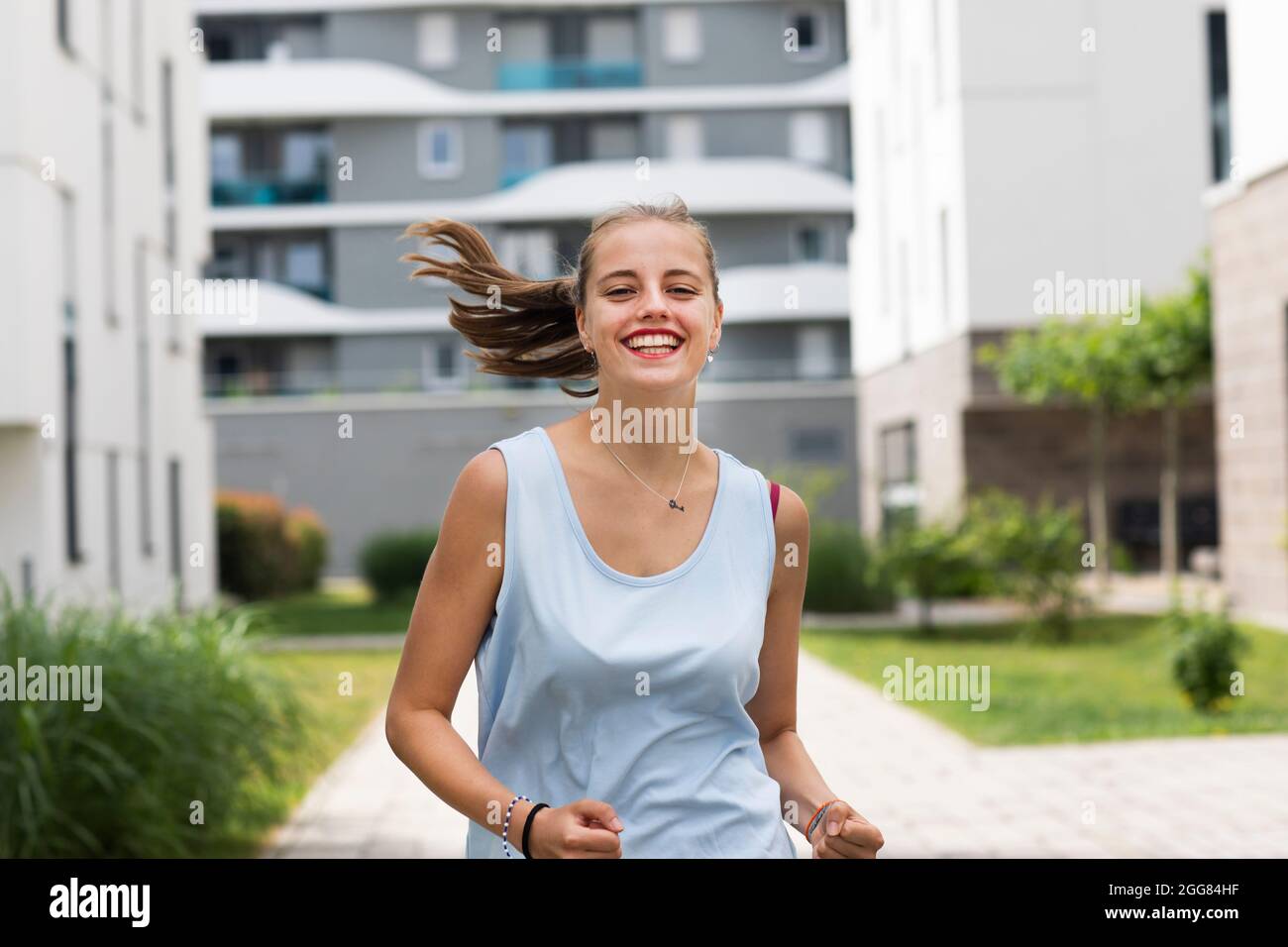 Young woman with blond hair jogging hi-res stock photography and images ...