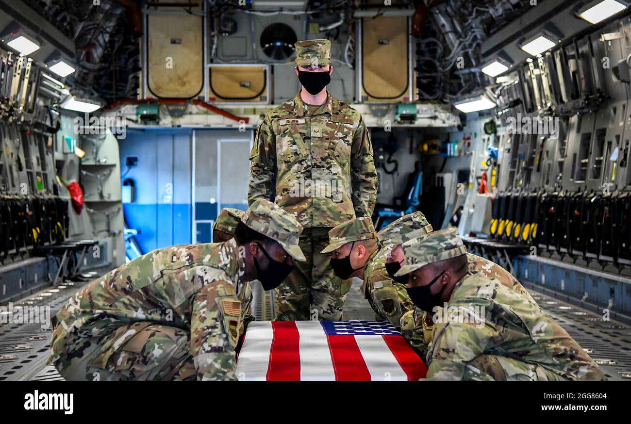 A U.S. Air Force carry team prepares to raise a training transfer case ...