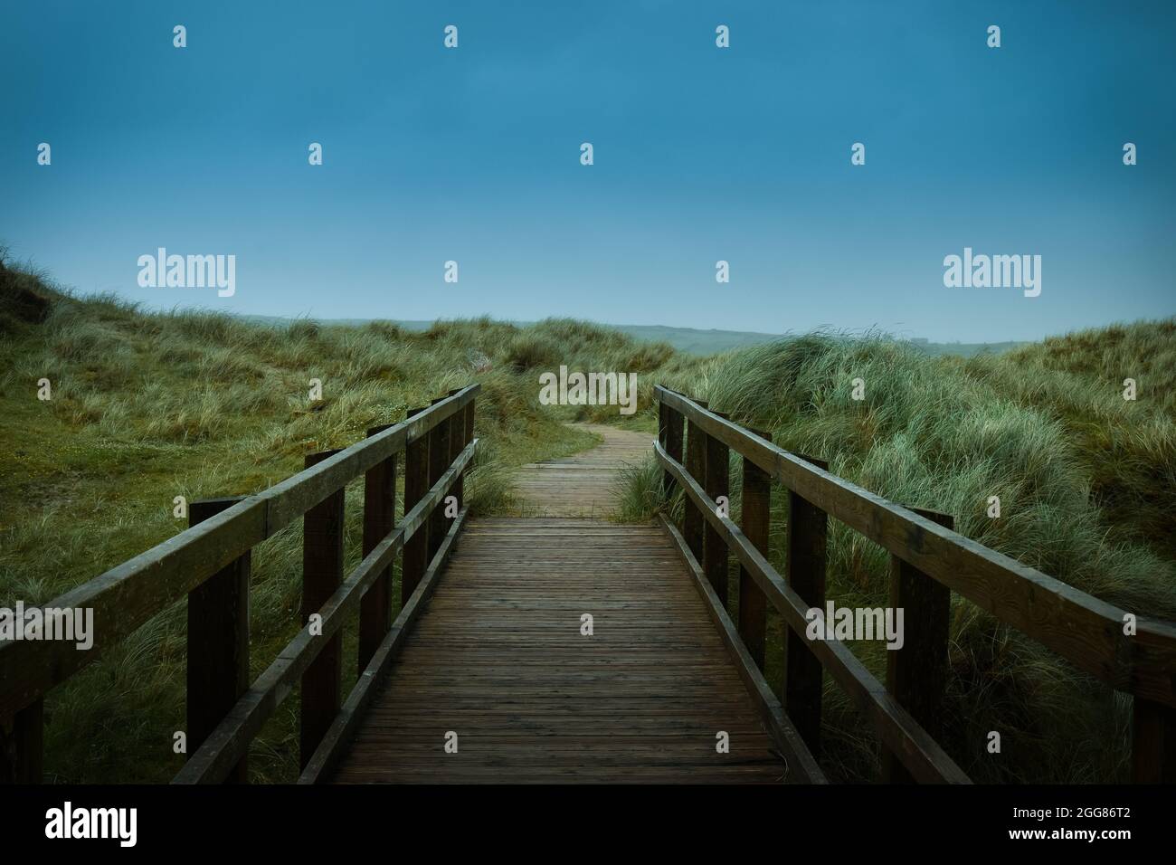 A wooden walkway on the coast of the Atlantic Sea in Ireland Stock ...
