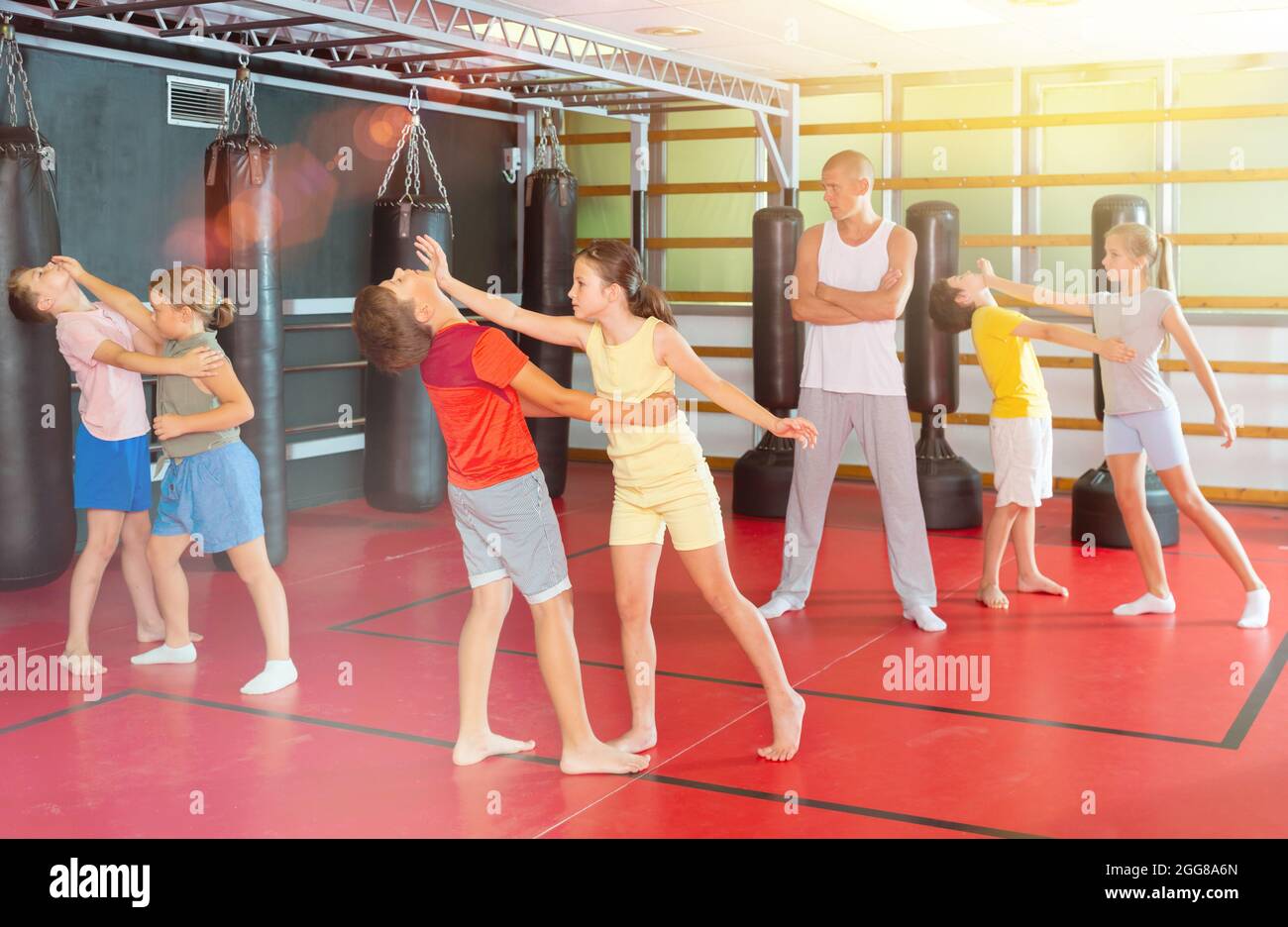Children practicing self defence technique in pairs Stock Photo - Alamy