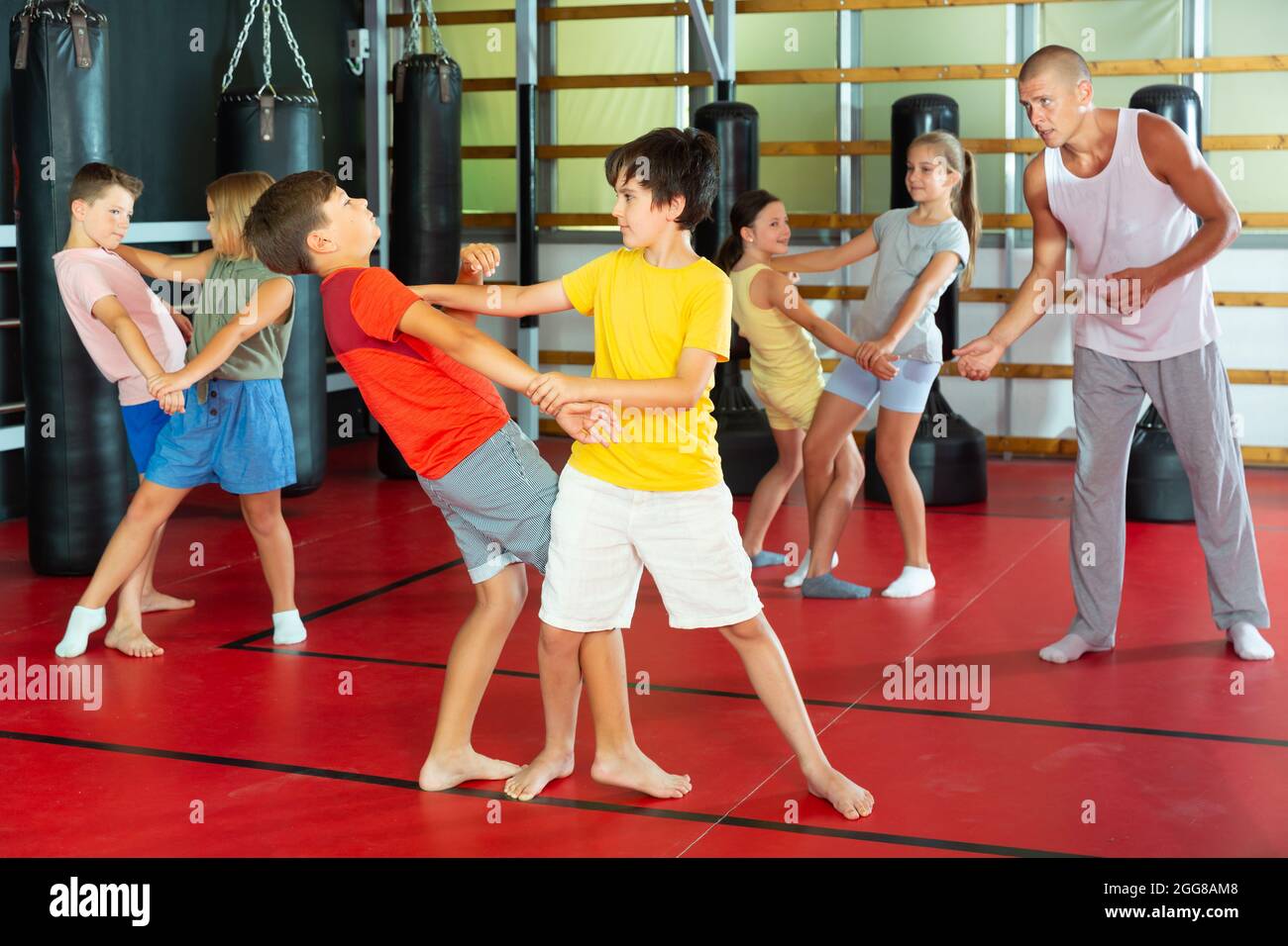 Children practicing self defence technique in pairs Stock Photo - Alamy