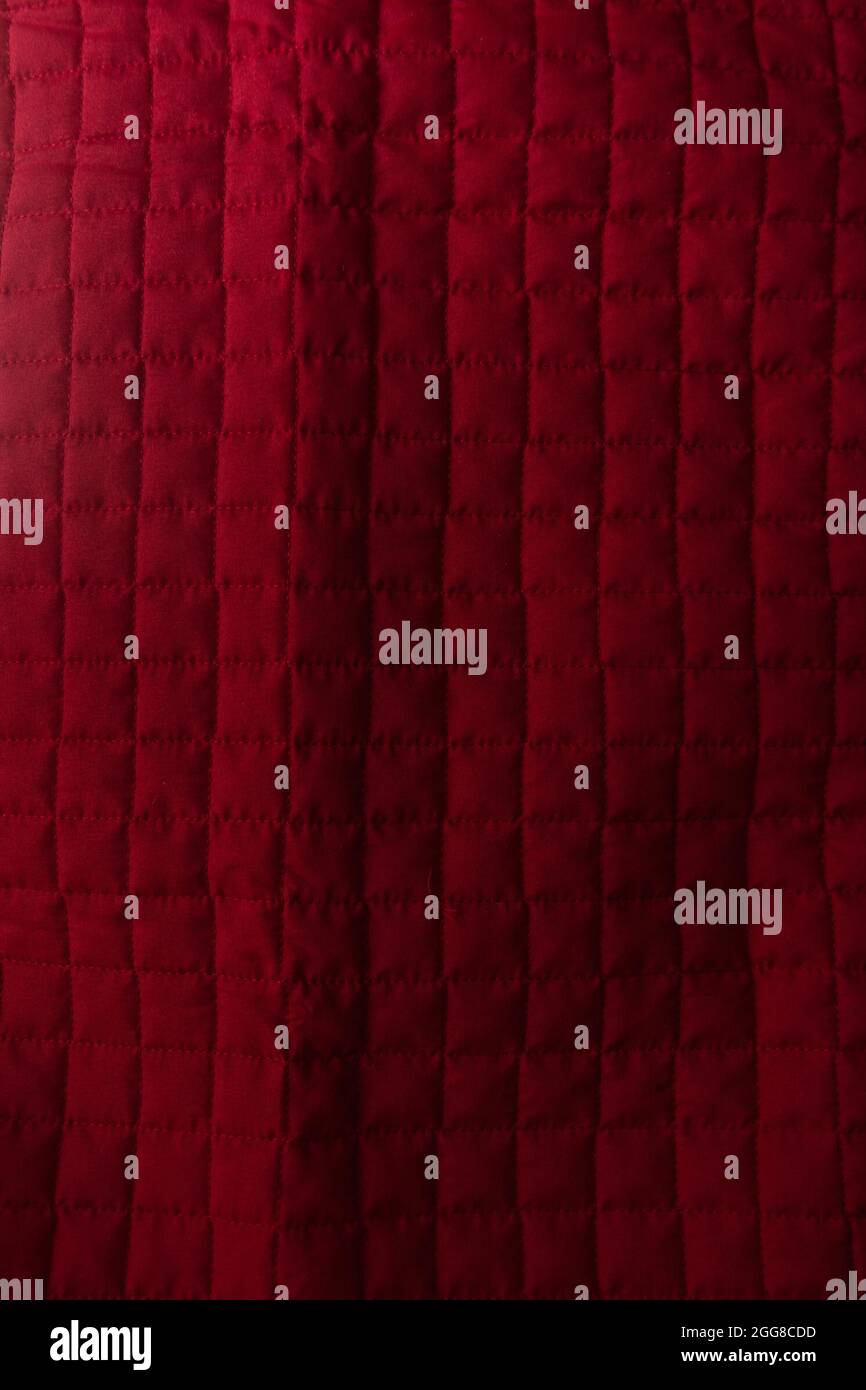 Red texture on bed cloth with divided into checkered parts. Salvador ...
