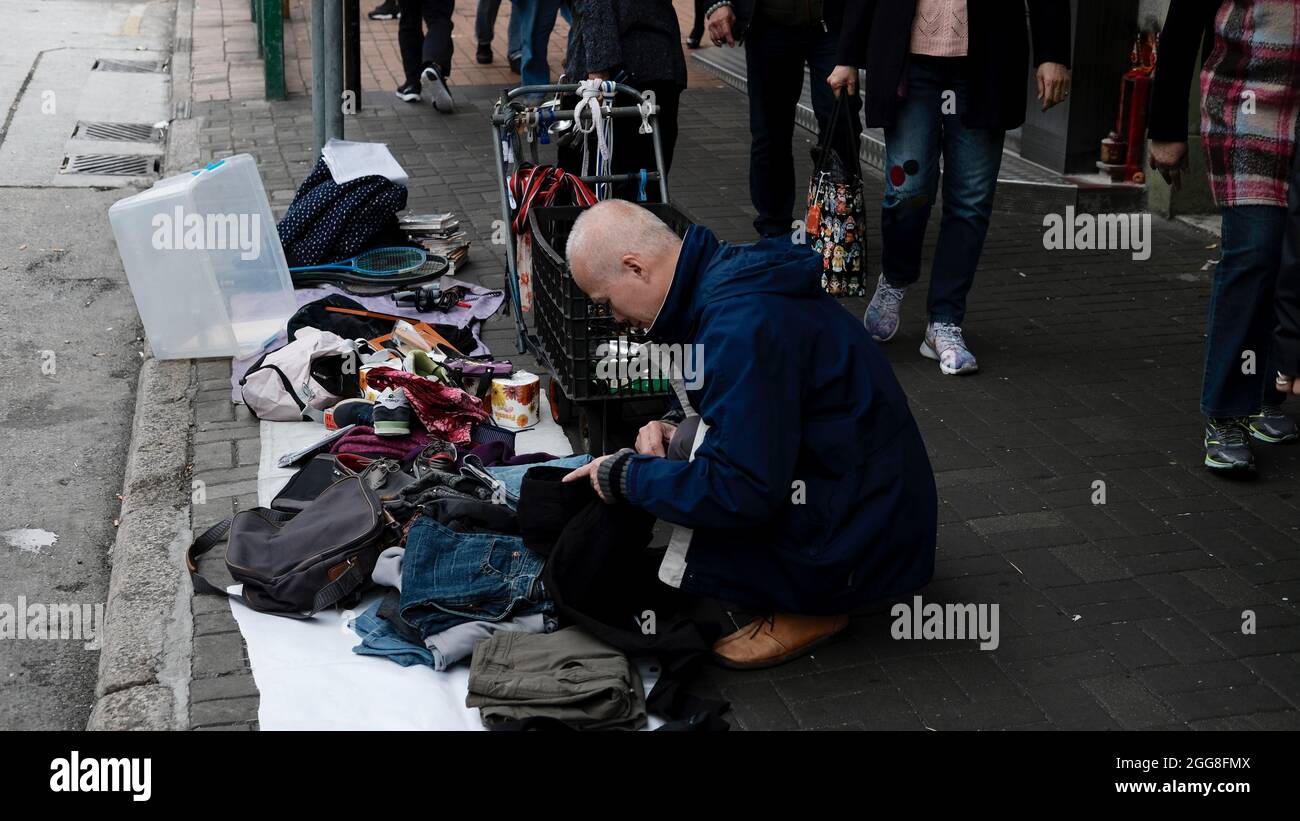 Man selling personal items in the Least affluent neighborhood Sham Shui ...