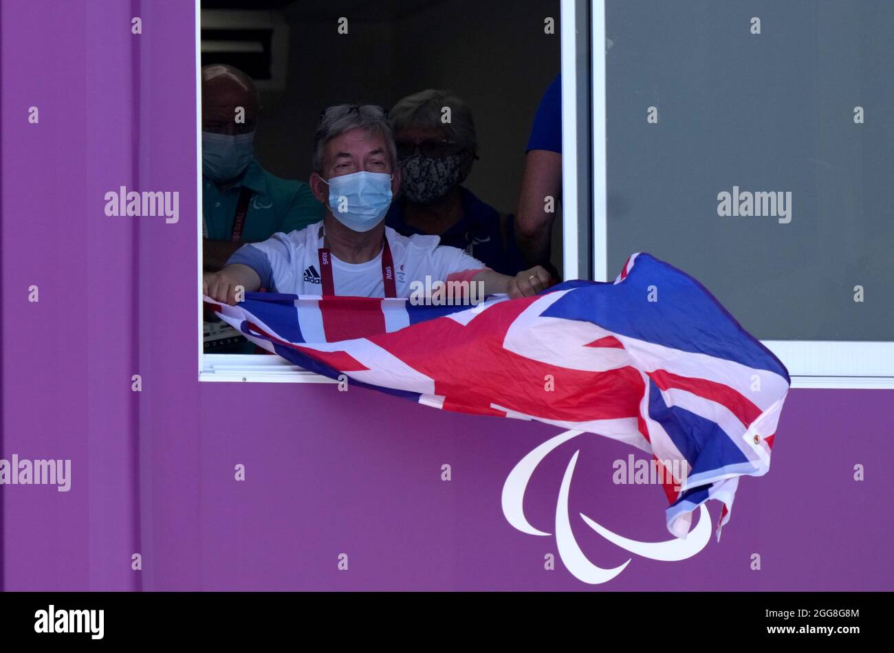 A member of the coaching staff cheers on Great Britain's Phoebe ...