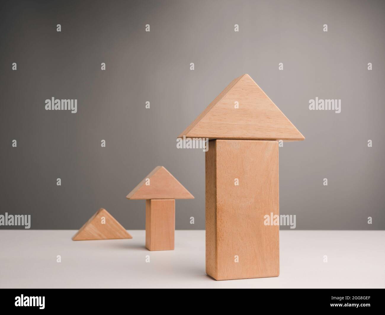Business growth success concept. Three size of wooden blocks stacking ...