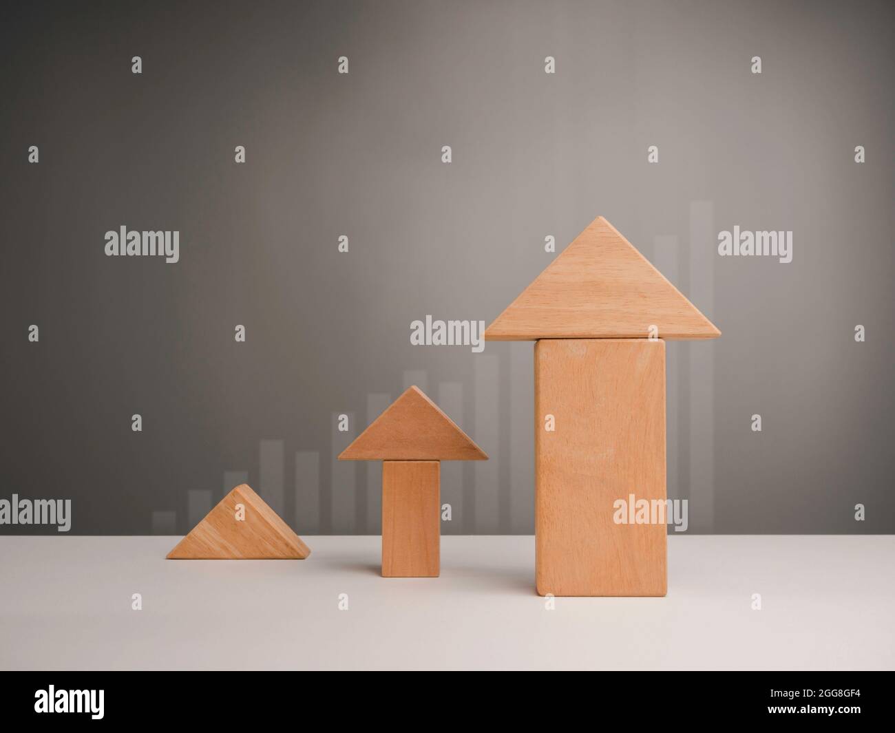 Business growth success concept. Three size of wooden blocks stacking ...