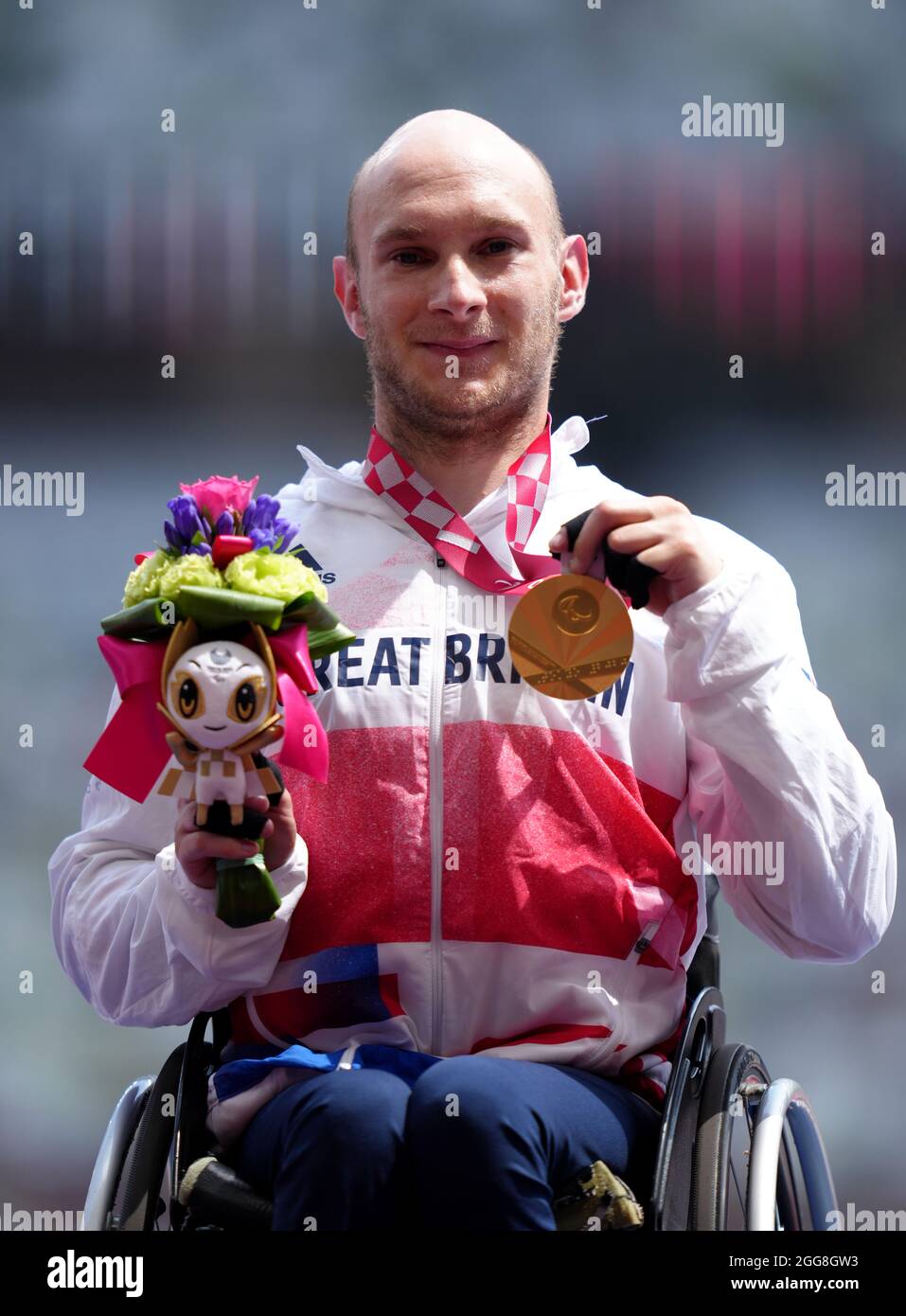 Great Britain's Andrew Small poses with his gold medal after winning ...