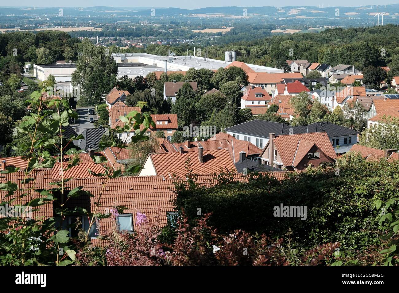 Cityscape with red building roofs and green trees Stock Photo - Alamy