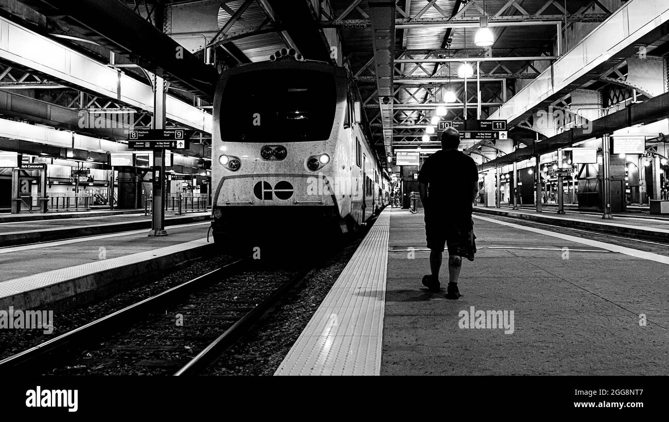 This man late one night trying to catch his train Stock Photo - Alamy