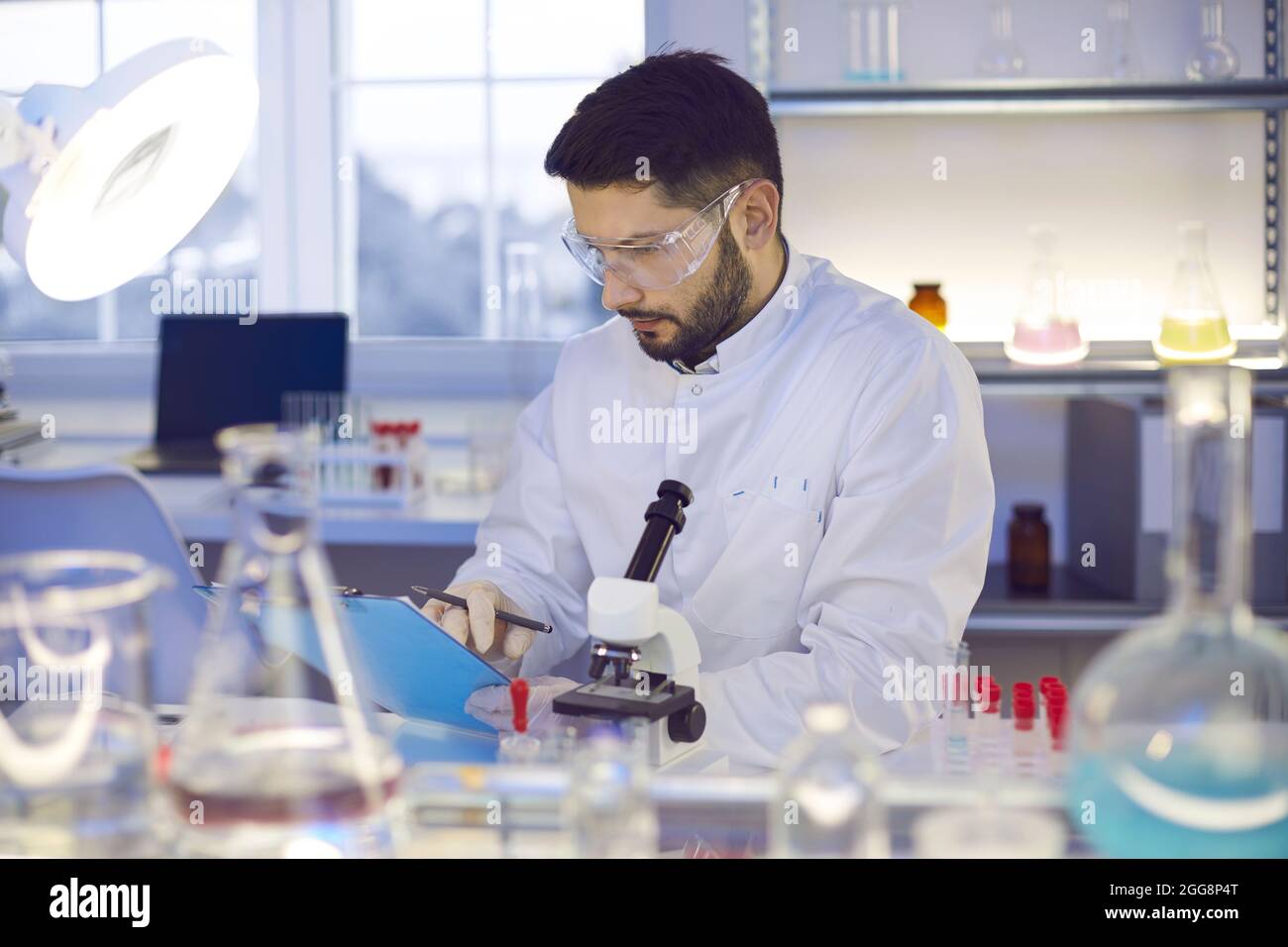 Male scientist writing notes in hi-res stock photography and images - Alamy