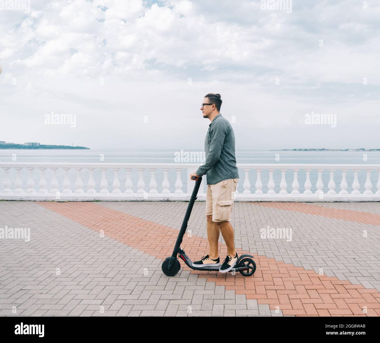 Man riding on an e scooter hi-res stock photography and images - Alamy