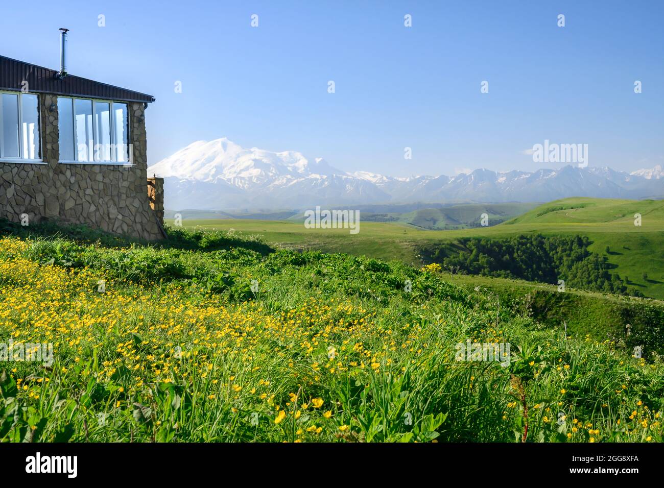 Stone terrace with a view of the valley with a mountain range covered ...