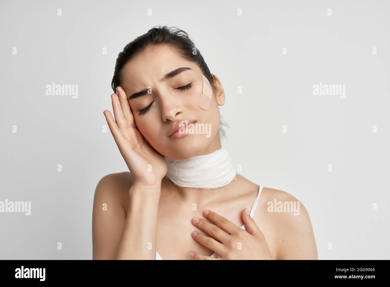 sick woman bandaged neck negative headache isolated background Stock ...
