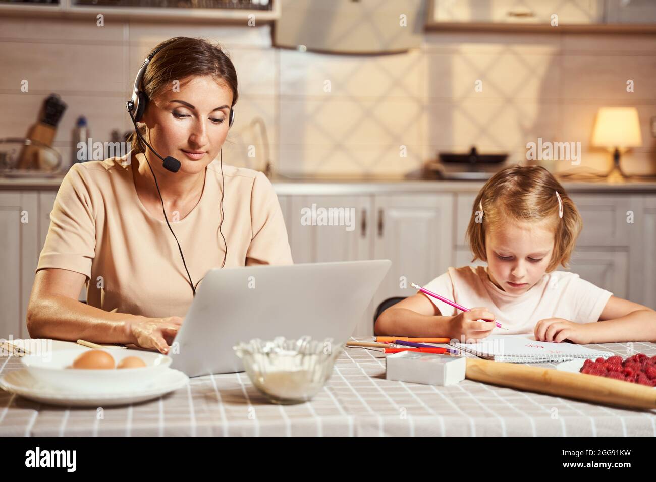 Woman and child focused on work and drawing Stock Photo - Alamy