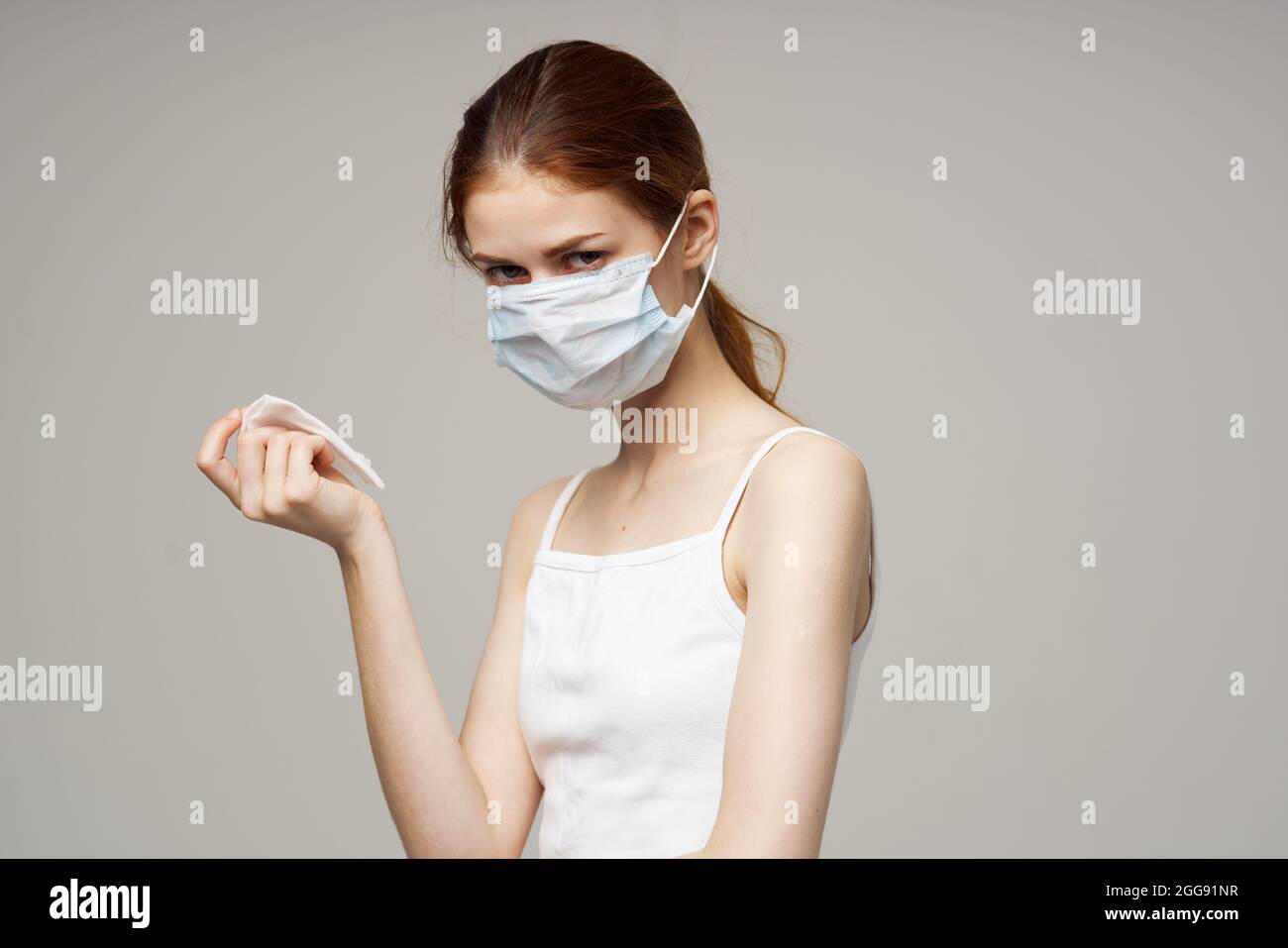 red-haired woman flu infection virus health problems light background ...