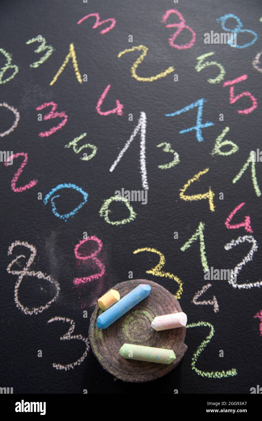 Graphic representation with chalk on blackboard with colorful numbers ...