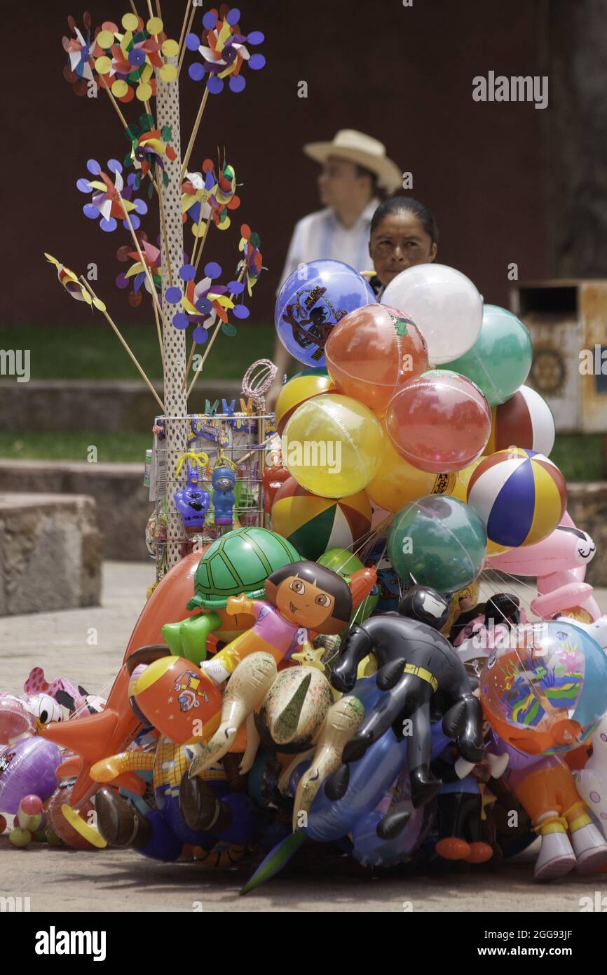 Child selling balloons hi-res stock photography and images - Alamy