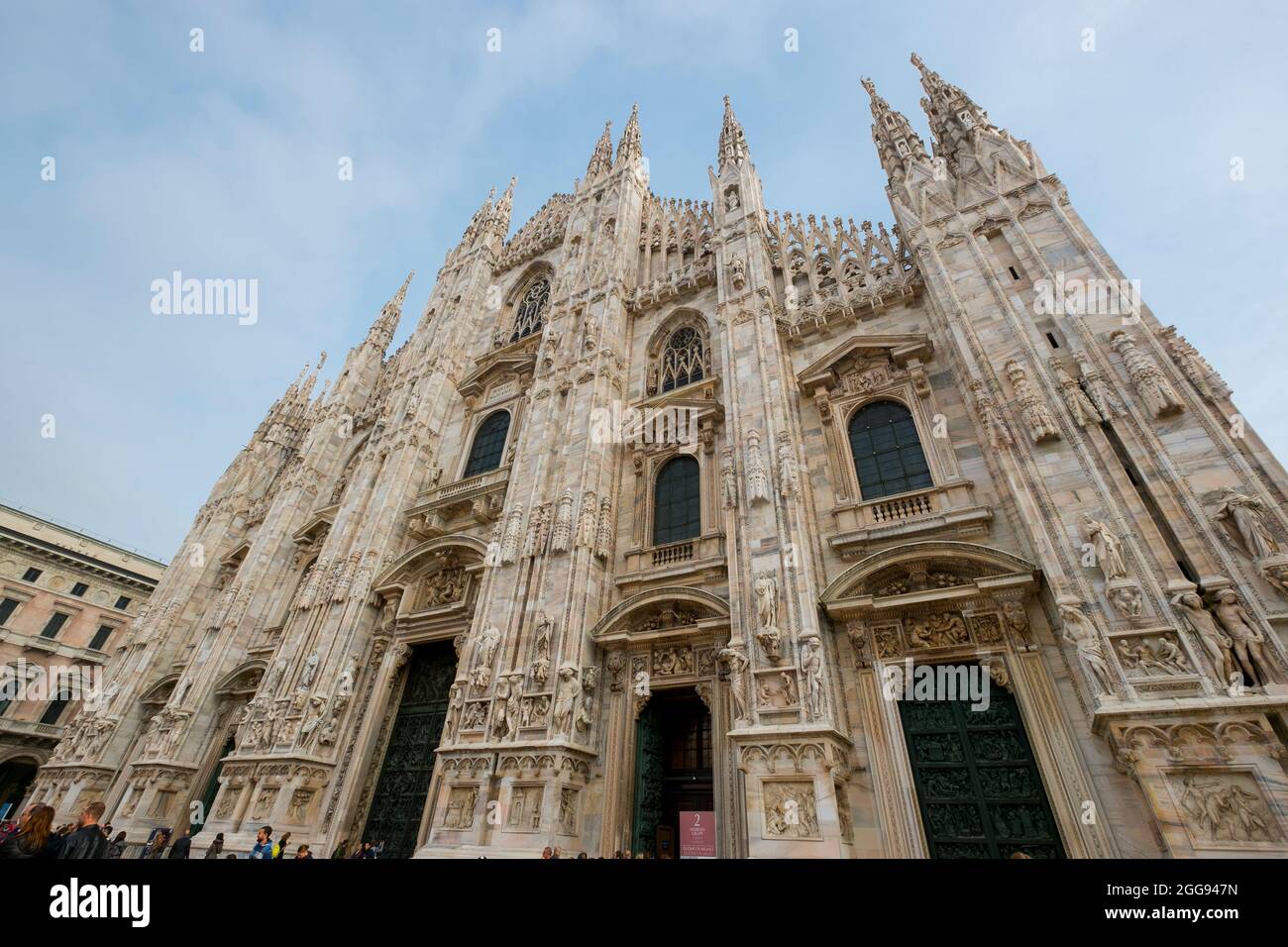 A low angle, looming, moody view of the front facade of the Catholic ...