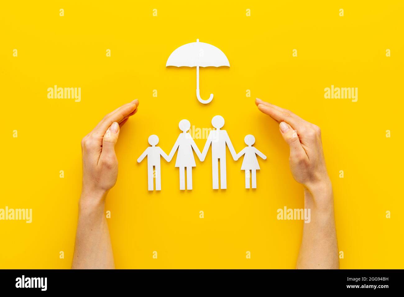 Hands hold family figure. Health insurance concept. Top view Stock ...