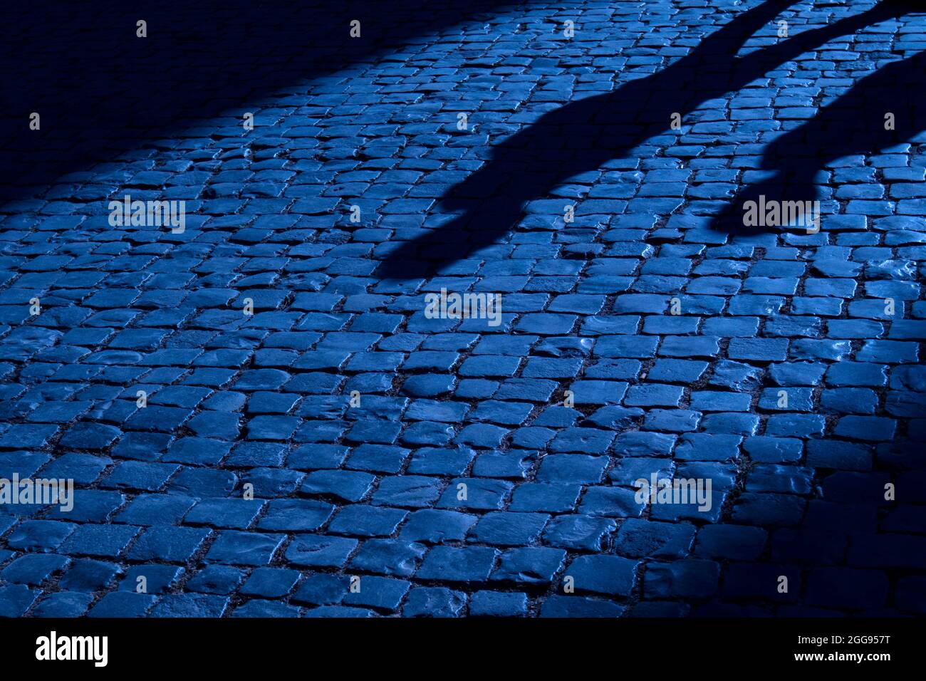 Street photography represents the shadows that arise at sunset time ...