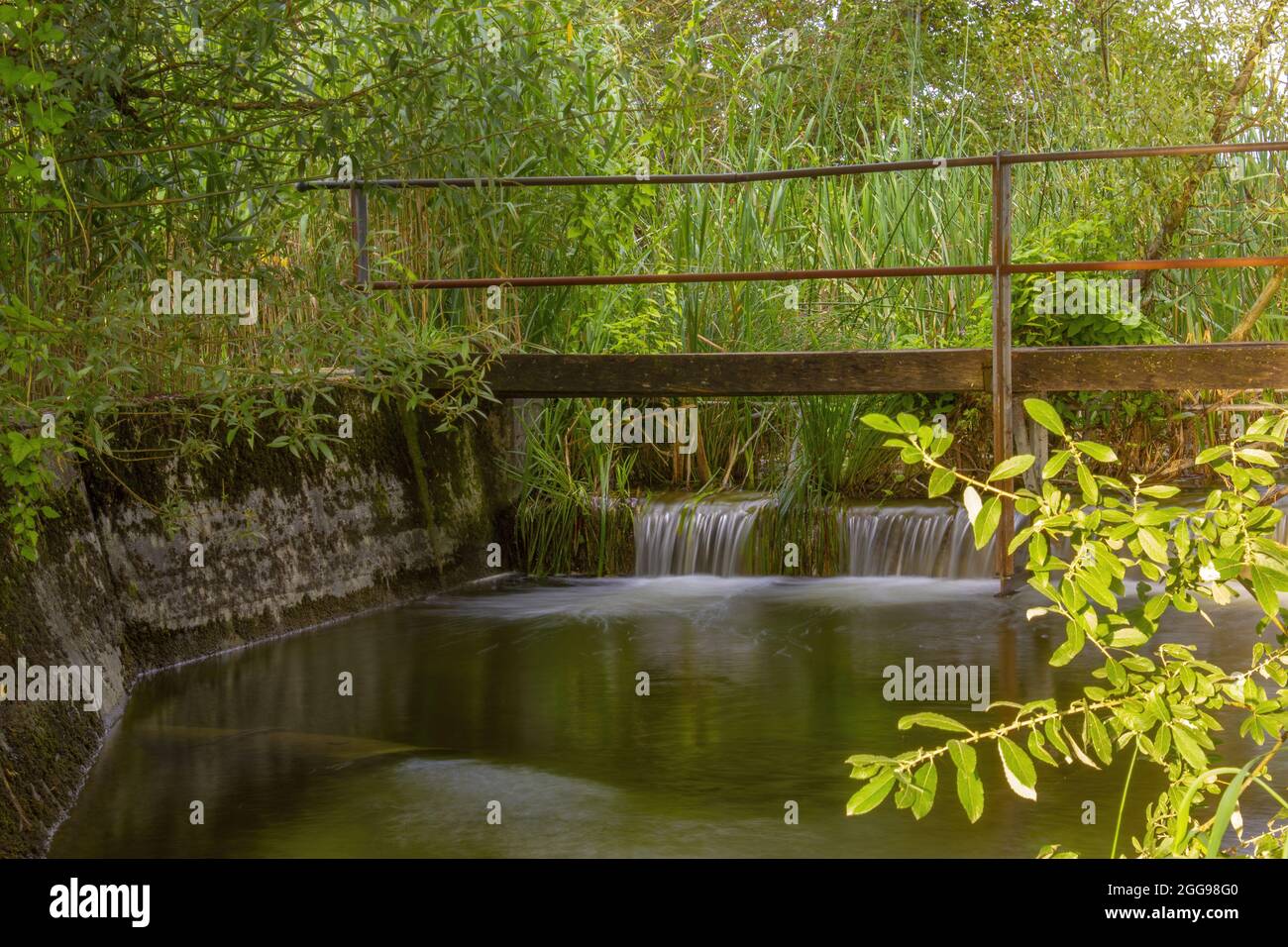 Flowing water in a narrow water channel in Mauensee, Lucerne ...