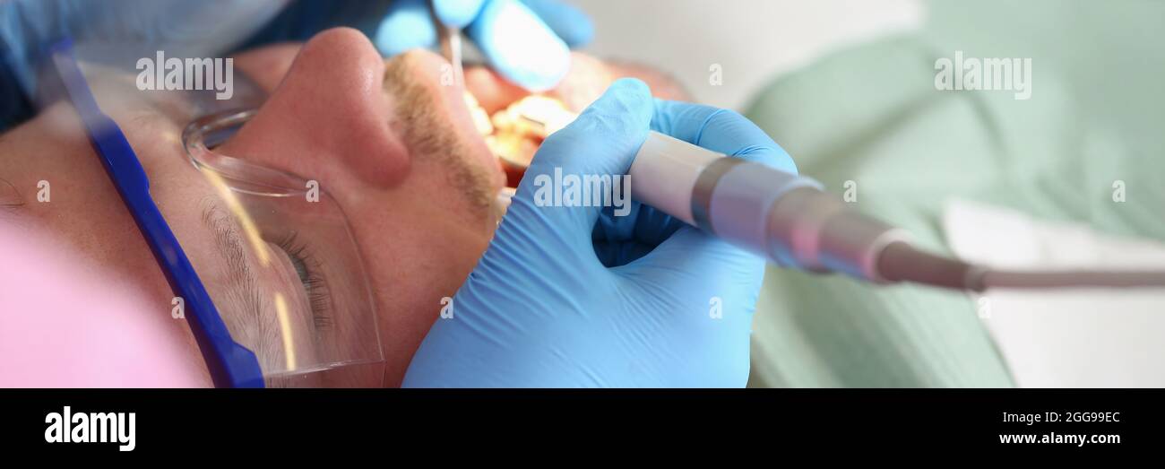 Dentist treating teeth young hi-res stock photography and images - Alamy