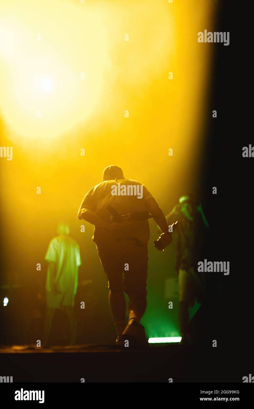 Music band on stage of background lights on concert or festival. A ...