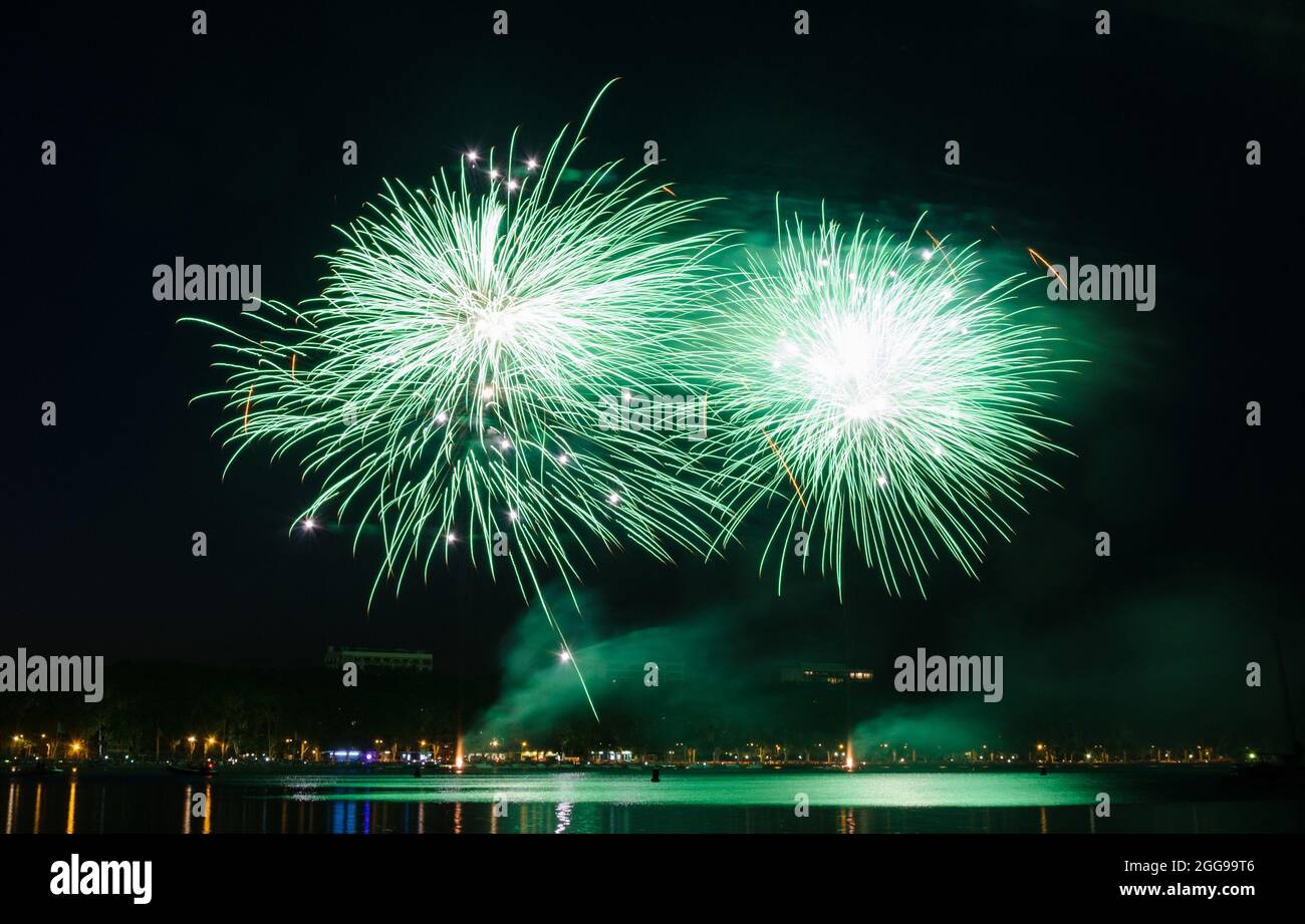Beautiful fireworks show on a lake Stock Photo - Alamy