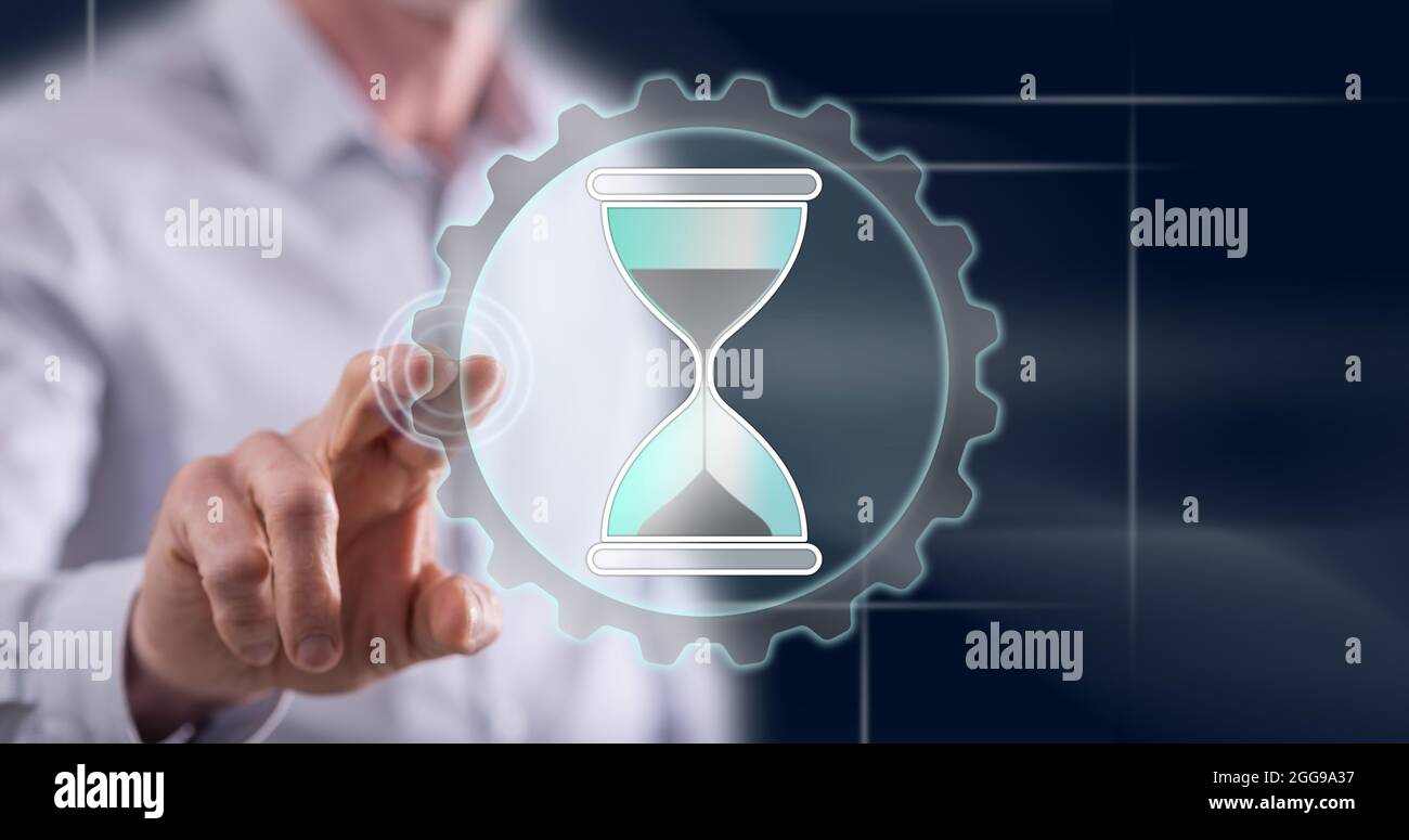Man touching a time management concept on a touch screen with his ...