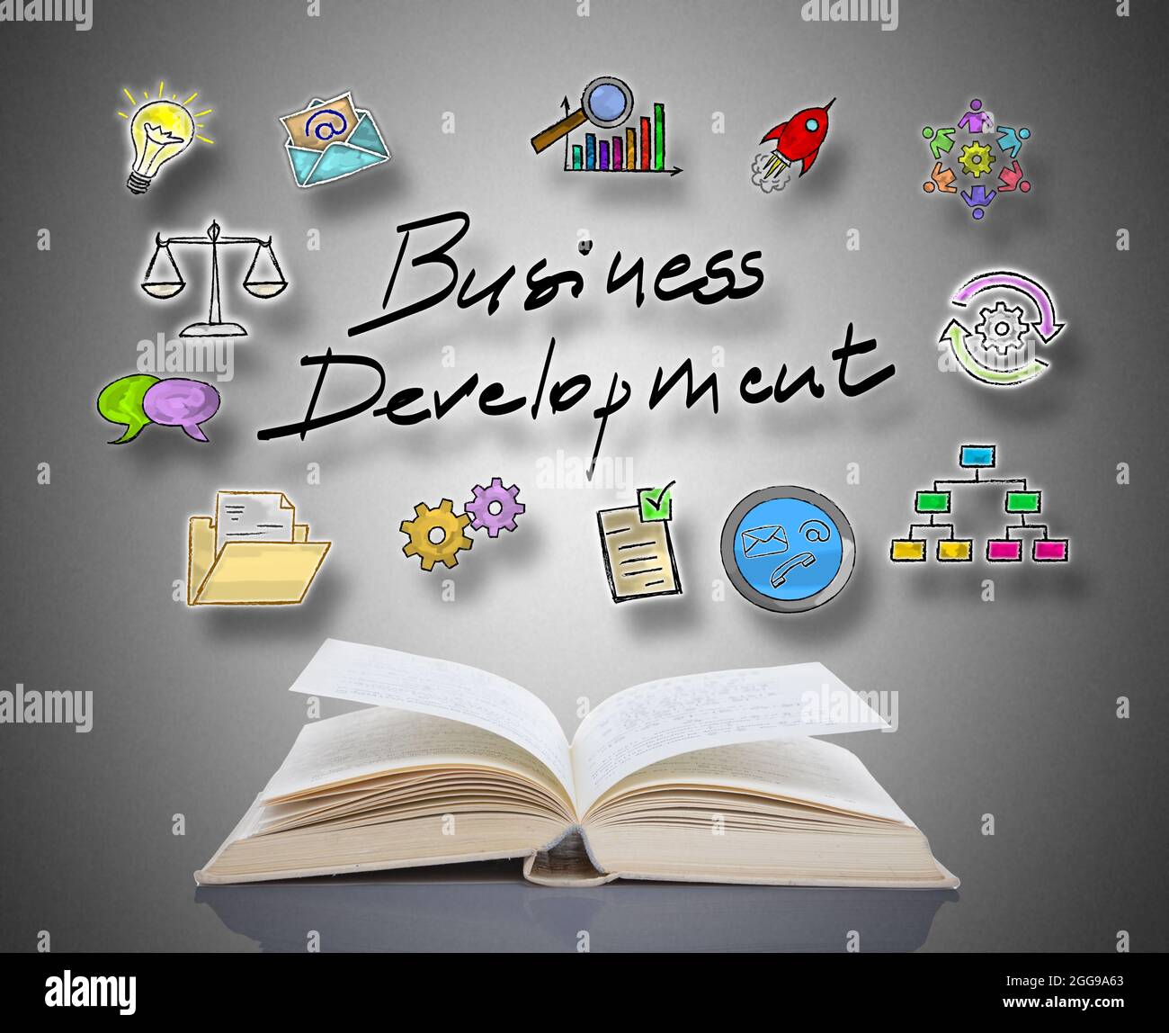 Business development concept above an open book Stock Photo - Alamy
