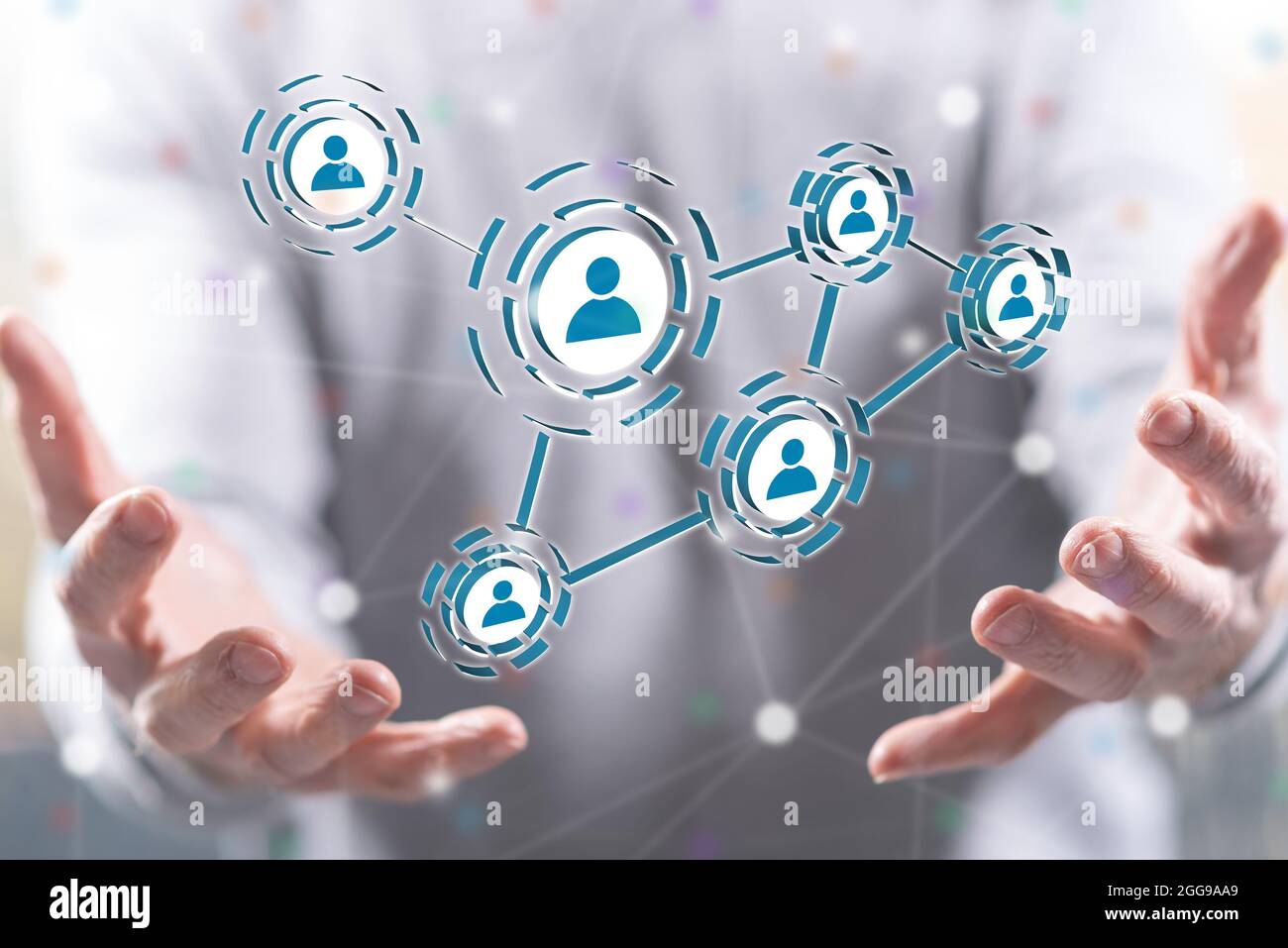 Social media and teamwork concept above the hands of a man in ...