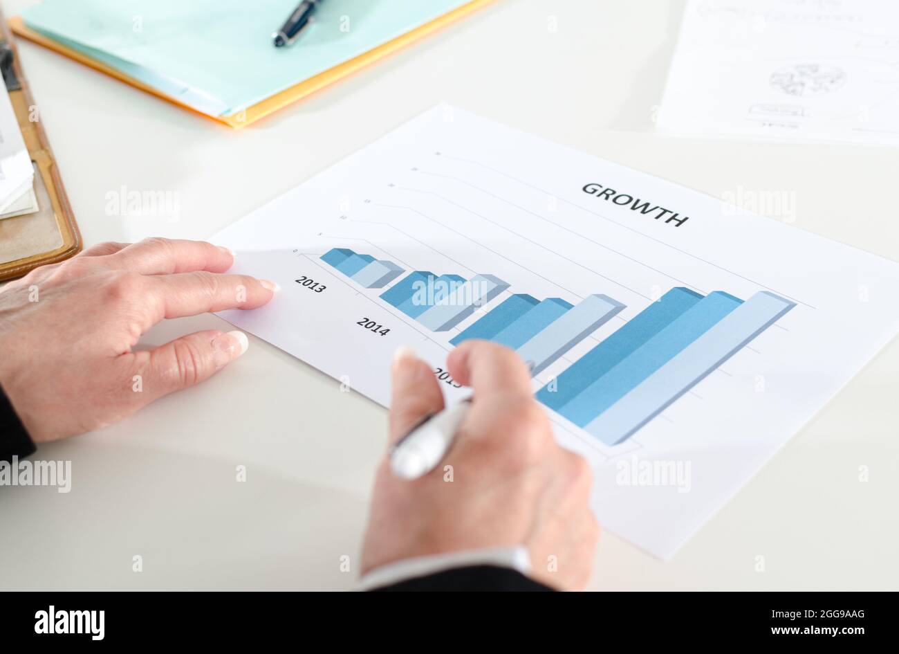 Analyzing growing results on a graphic Stock Photo - Alamy
