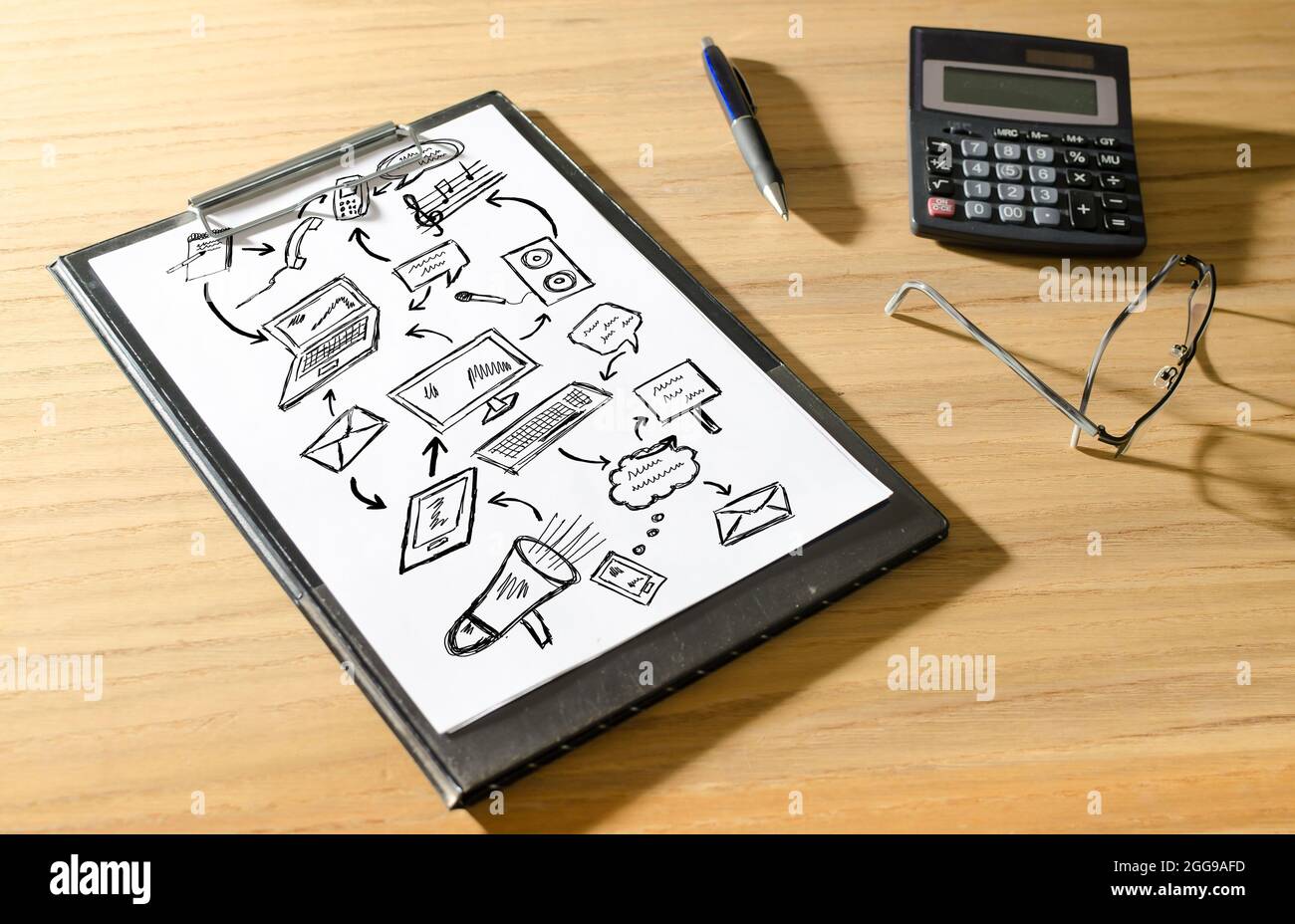 Communication concept on a clipboard with a calculator Stock Photo - Alamy