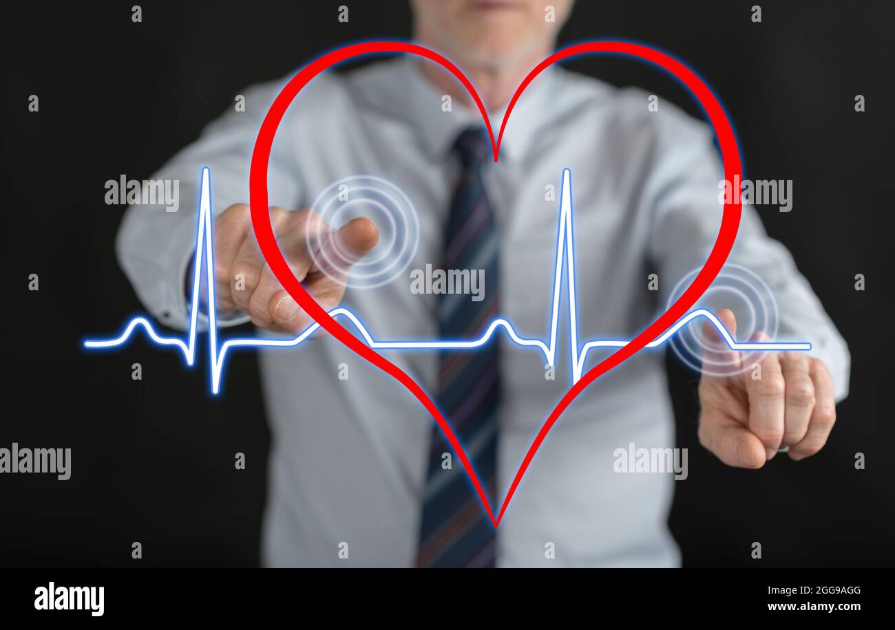 Man touching a heart beats graph on a touch screen with his fingers ...