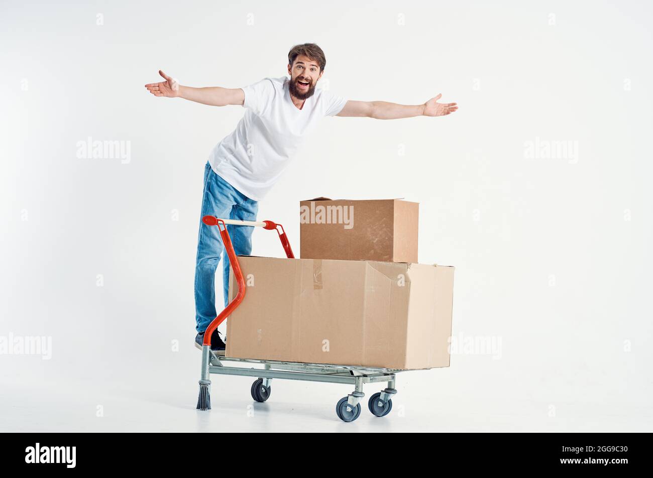 Man shipping transport in a box isolated background Stock Photo - Alamy