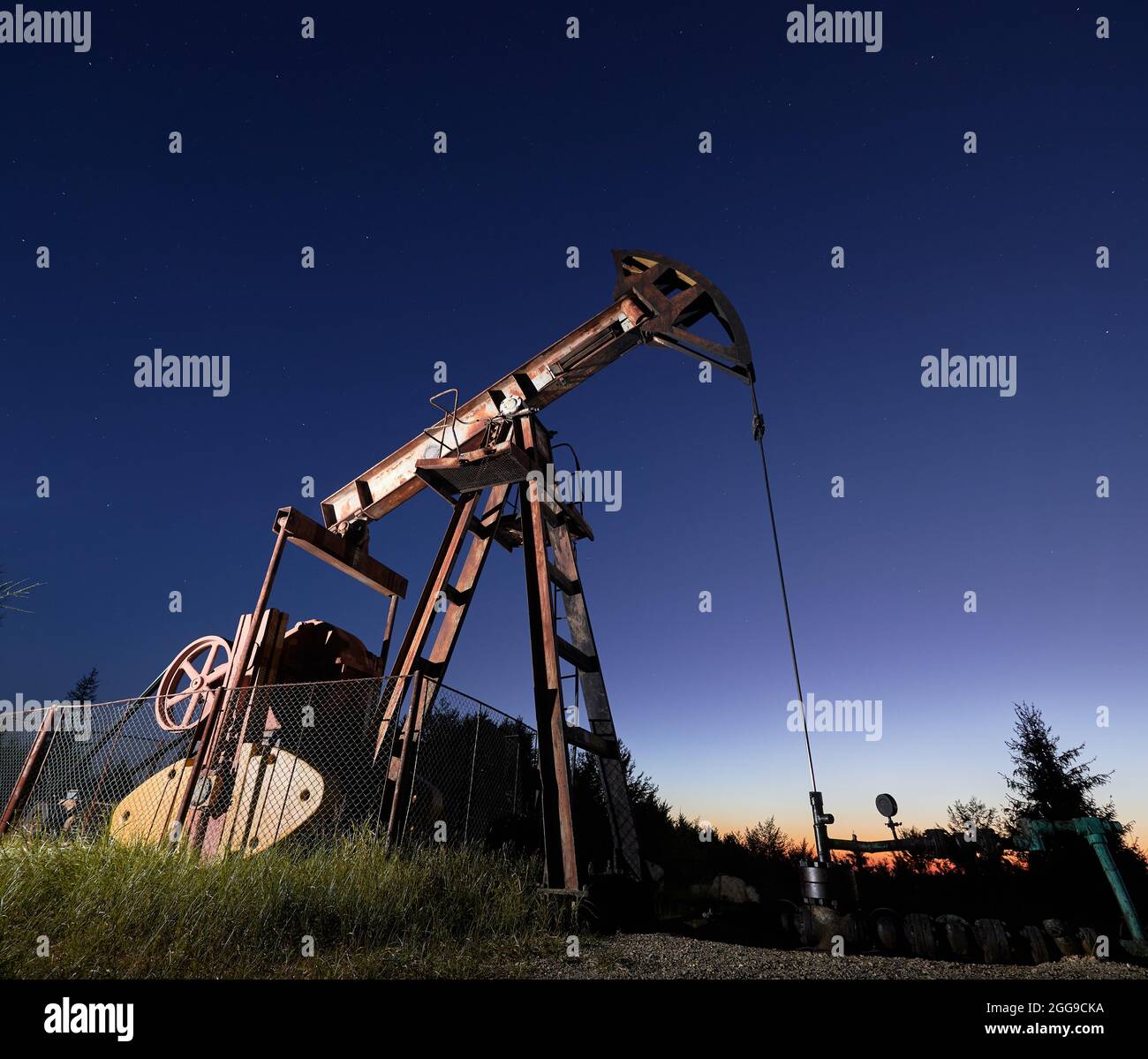 Beautiful view of night oil filed with petroleum pump jack. Oil pump ...