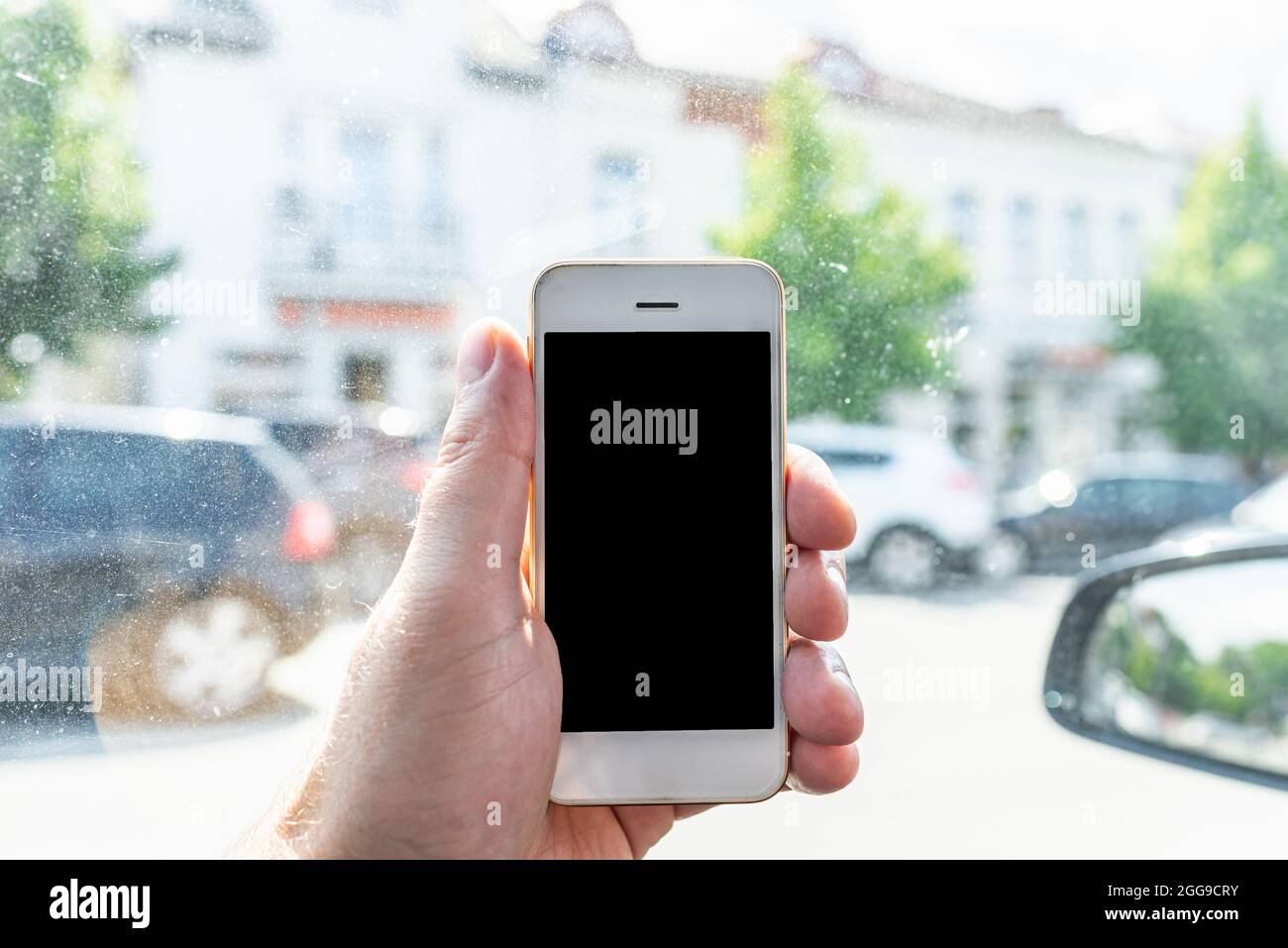 Man using phone in car, GPS navigation ,blank space frame on smartphone ...