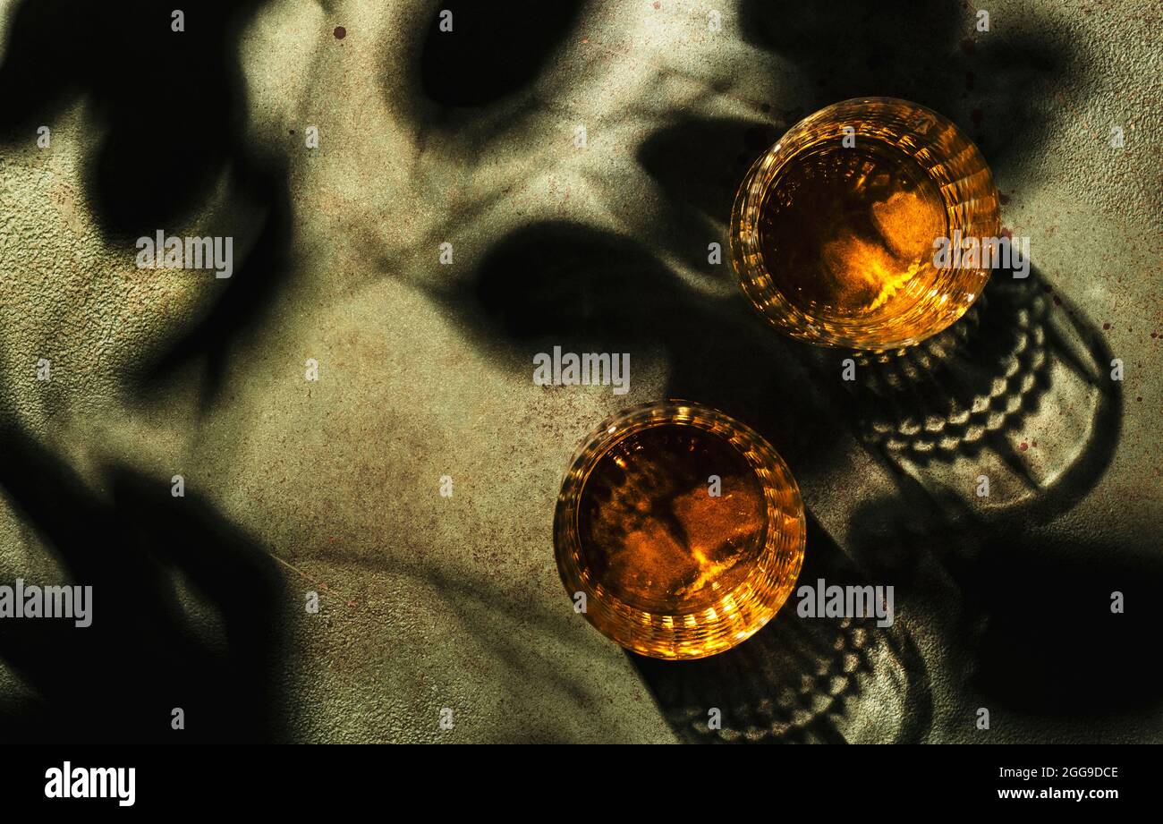 American bourbon whiskey in glasses, rusty green background with shadow ...